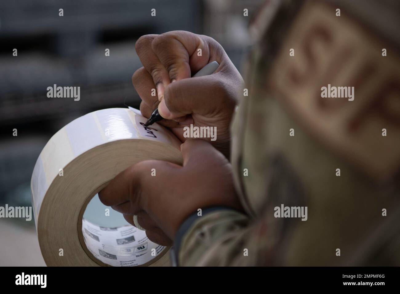 An Airman from the 386th Expeditionary Theater Distribution Center ...