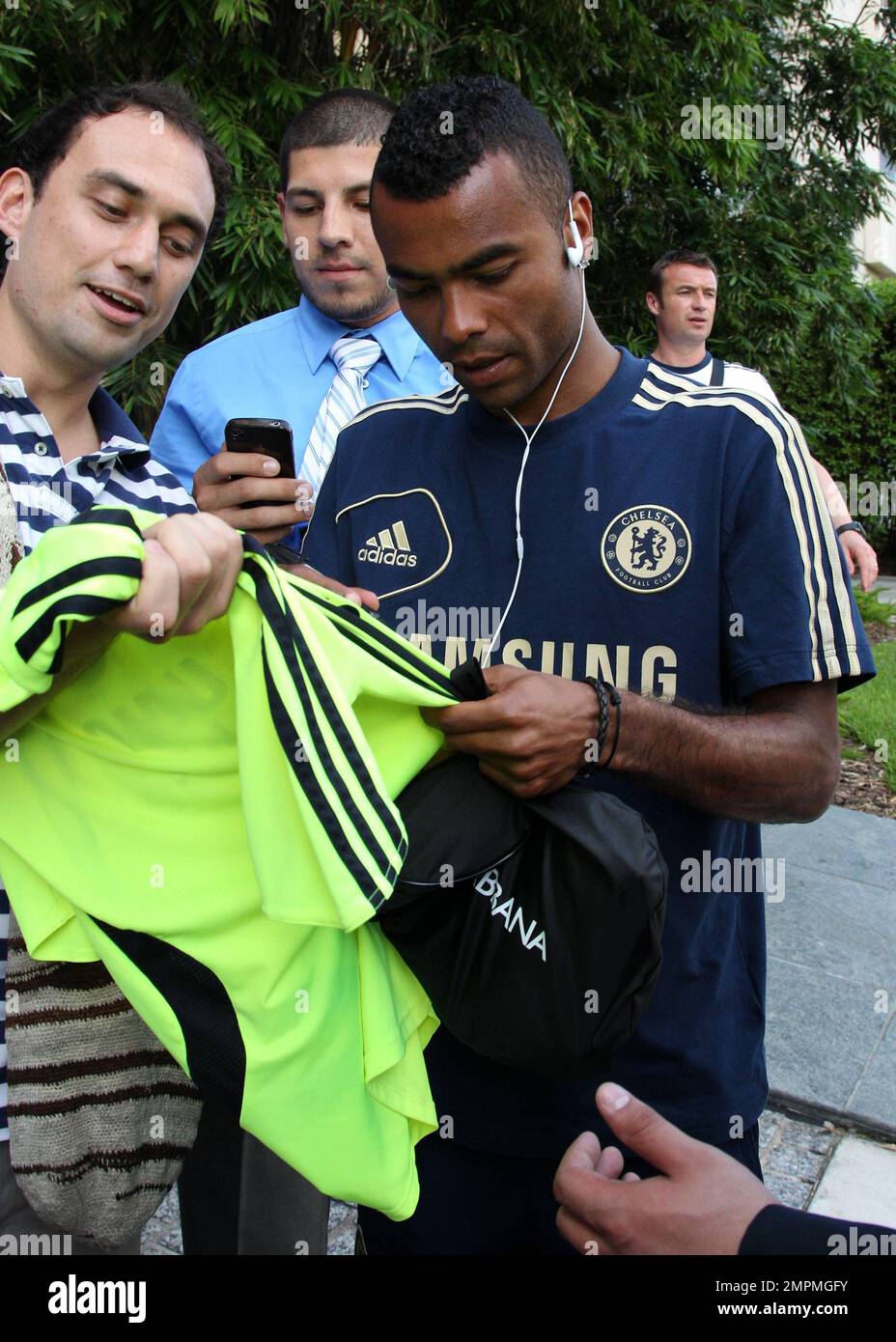 EXCLUSIVE!! Chelsea left back Ashley Cole poses for photos and signs ...