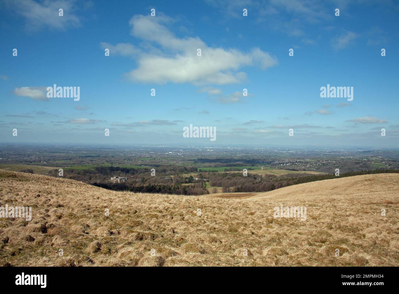 The main house at Lyme Park and The Cage with the City of Manchester in ...