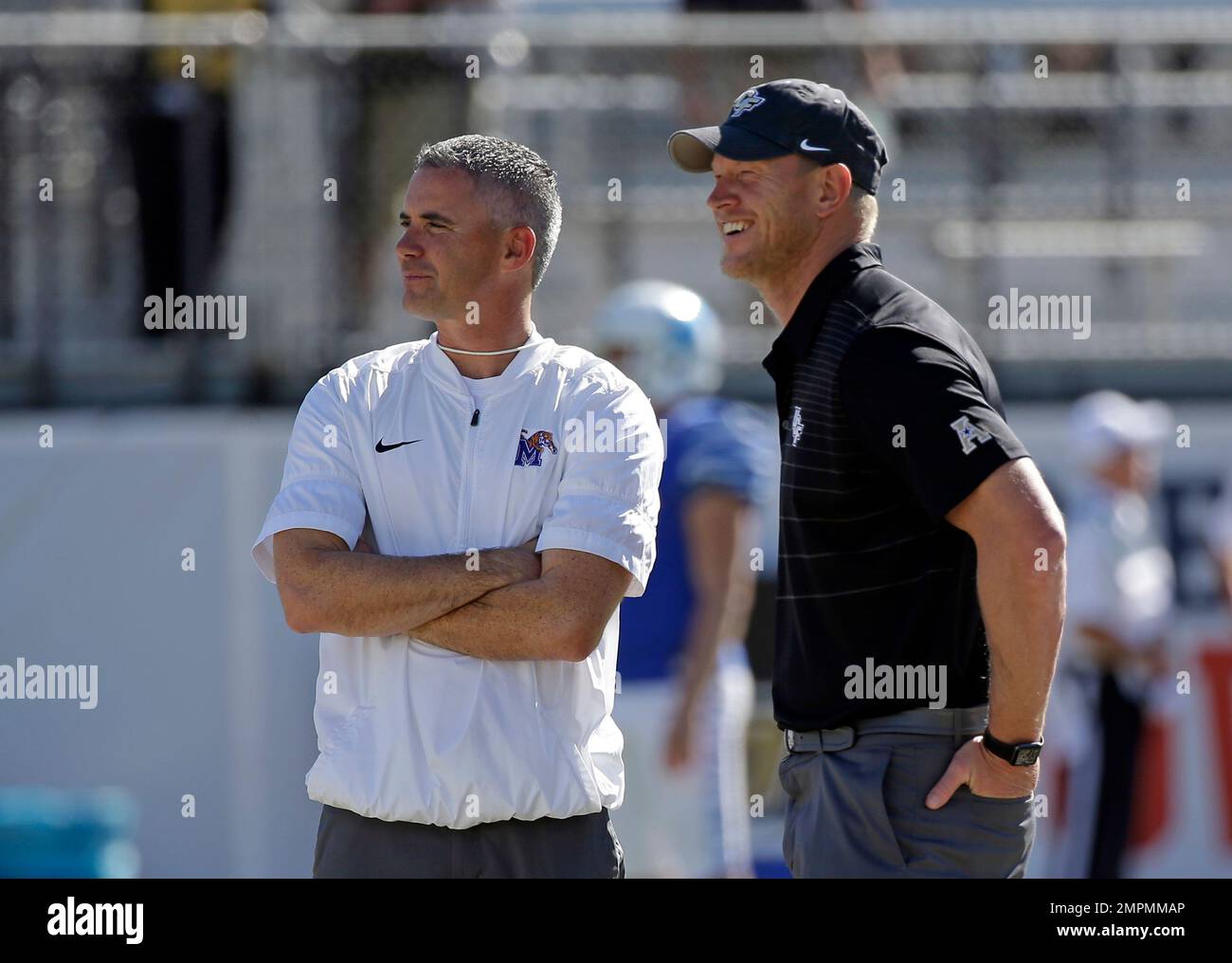 Memphis head coach Mike Norvell, left, and Central Florida head coach ...