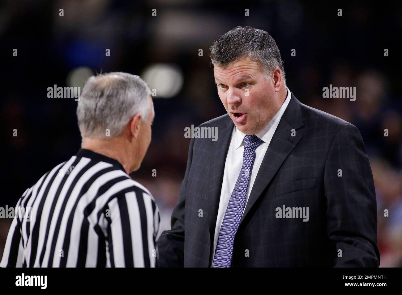 Creighton head coach Greg McDermott, right, speaks with a referee ...