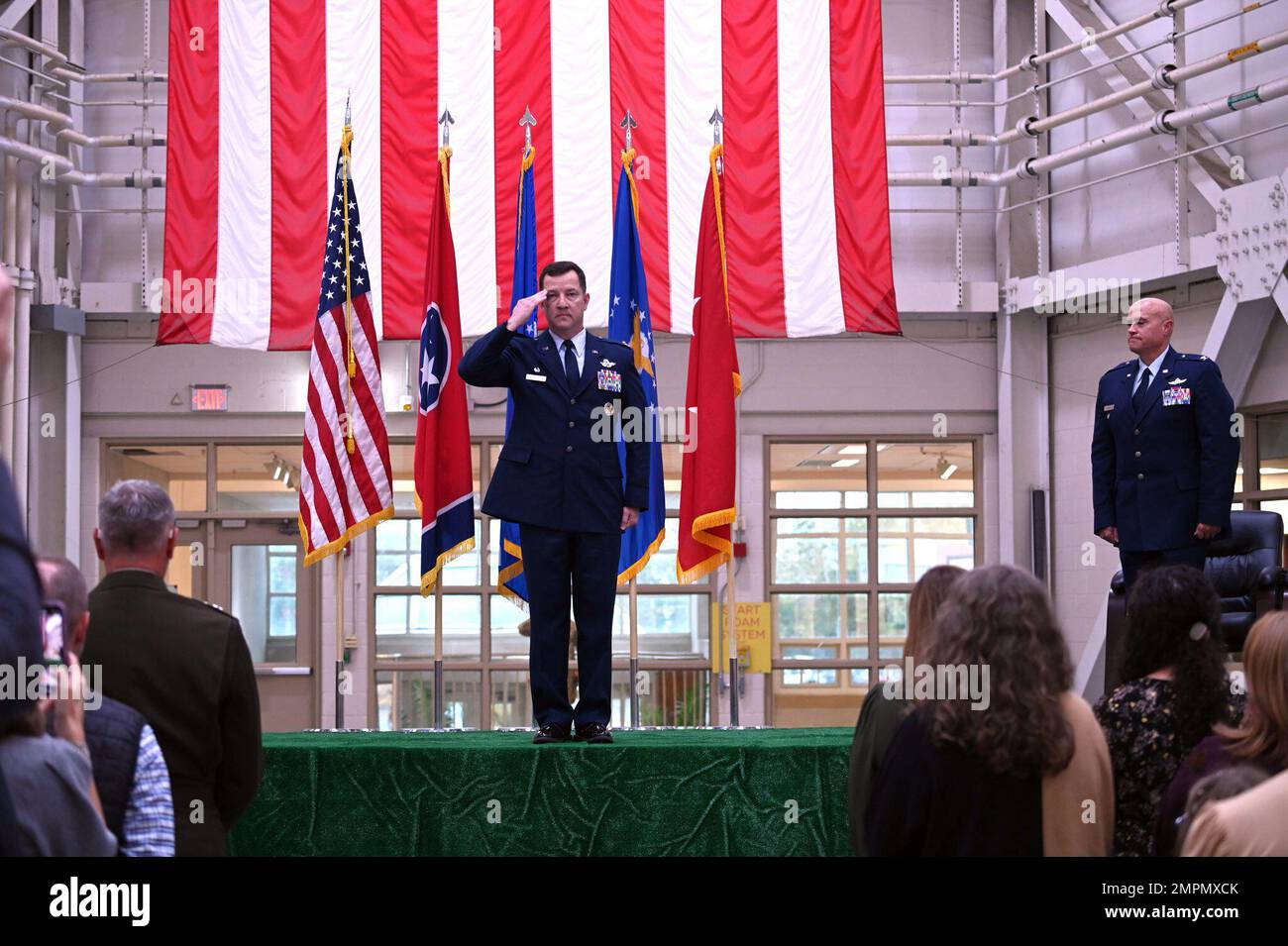 Col. Ted Geasley, incoming commander of the 118th Wing, salutes the ...