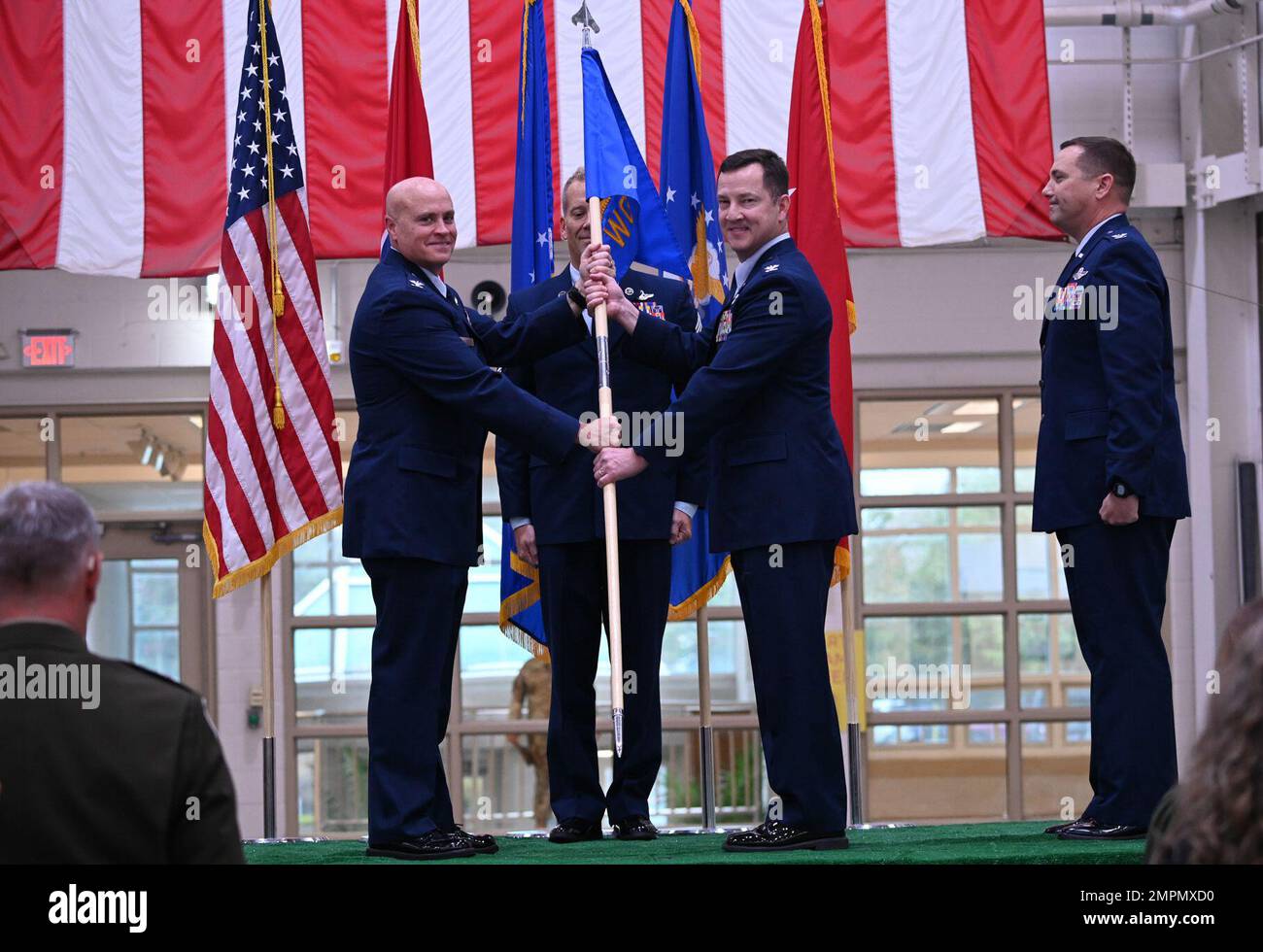Col. Ted Geasley, incoming commander of the 118th Wing, accepts the ...