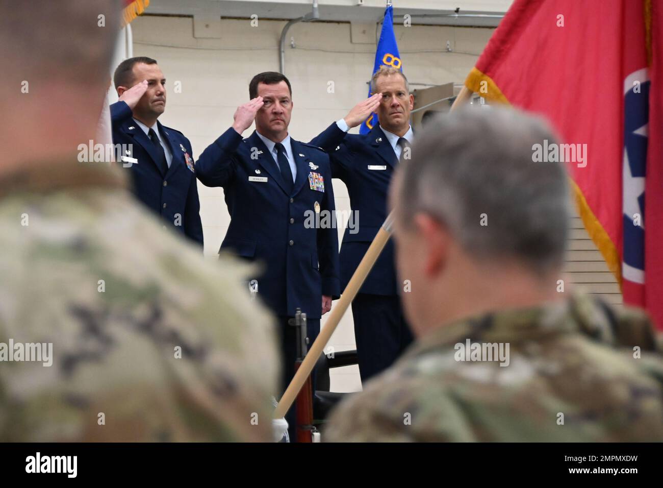 The incoming and outgoing leaders of the 118th Wing salute the wing’s Airmen November 5, 2022 at ...