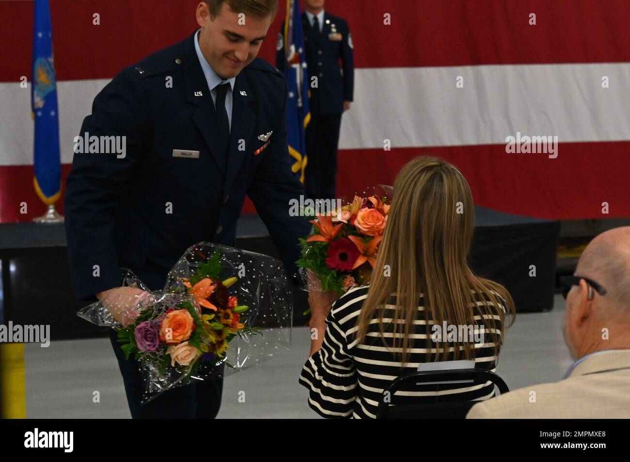 Lt. Col. Douglas Jeffrey IV's spouse receives flowers during the 507th ...