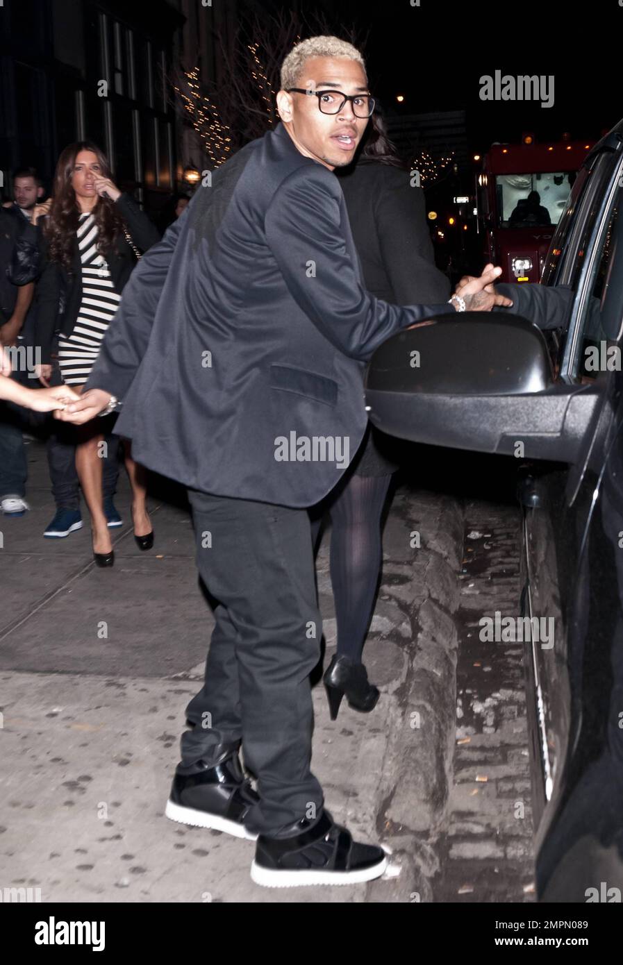 Accompanied by bodyguards and a female companion, Chris Brown enjoys ...