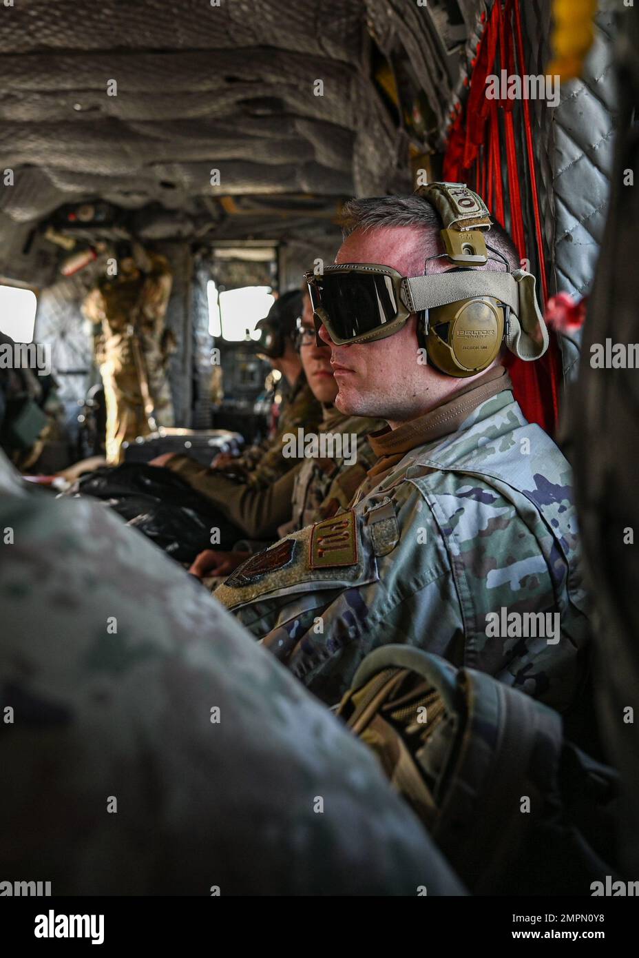 U.S. Air Force Airmen assigned to the 355th Wing fly on a U.S. Army CH ...