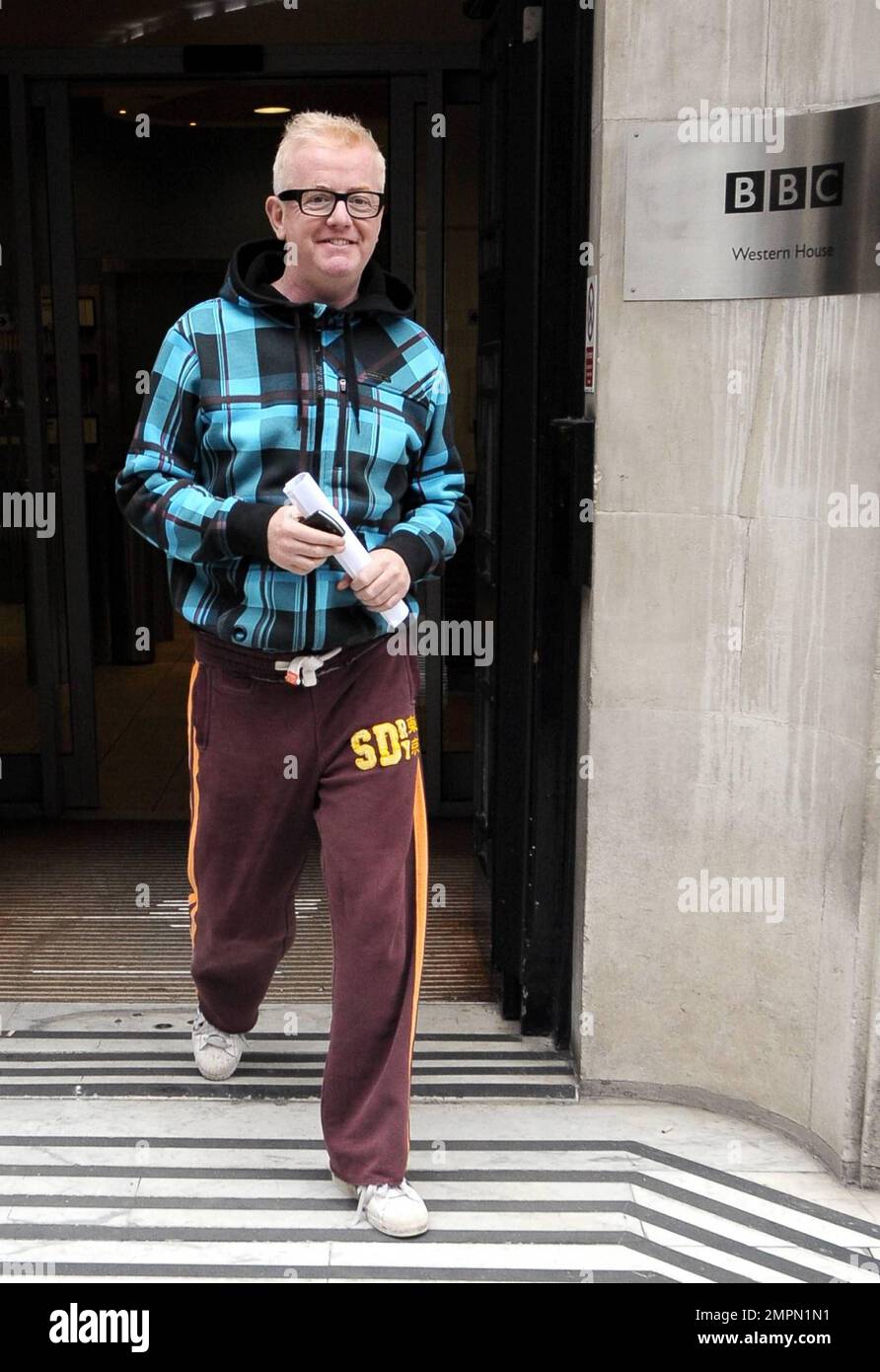 BBC Radio 2 DJ Chris Evans smiles for the cameras as he leaves work on ...