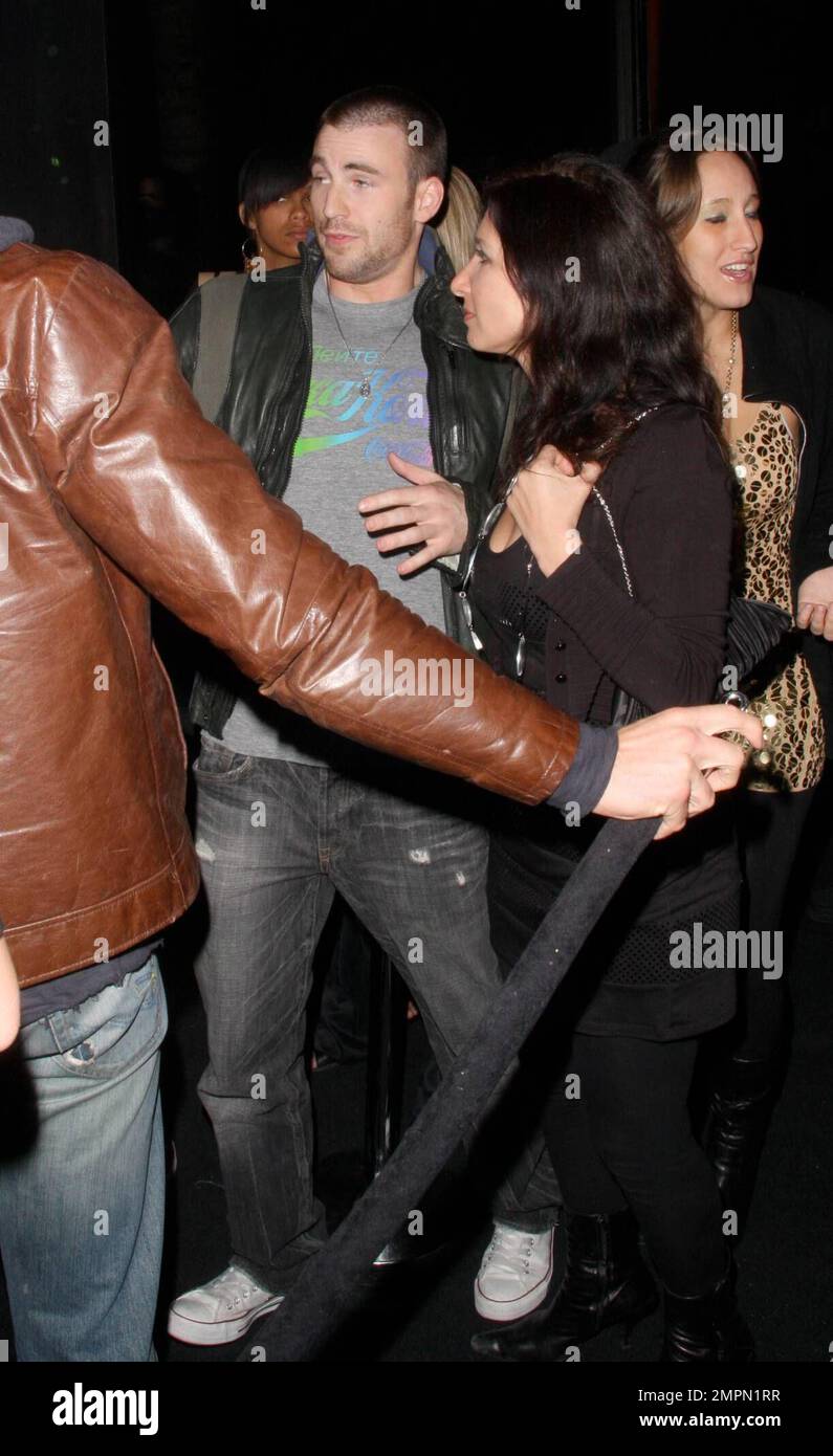 Actor Chris Evans hugs a friend as he arrives at the nightclub Ecco ...
