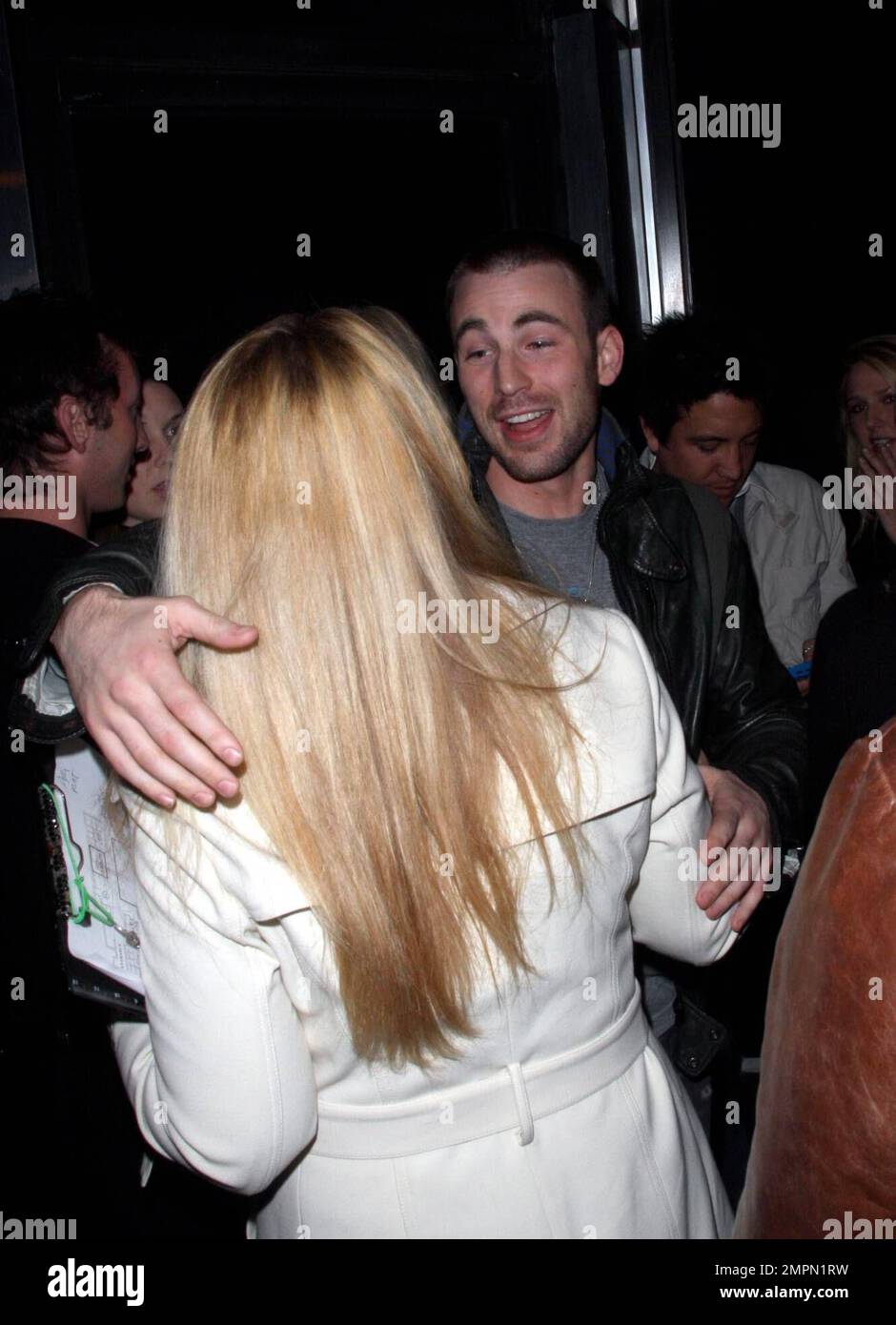 Actor Chris Evans hugs a friend as he arrives at the nightclub Ecco ...