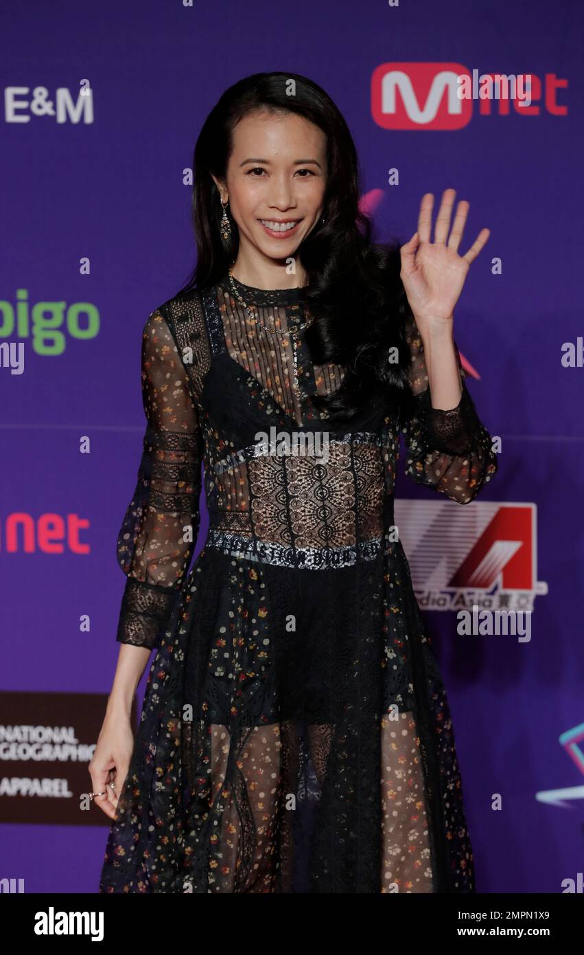 Hong Kong singer-actress Karen Mok poses for photos on the red carpet ...