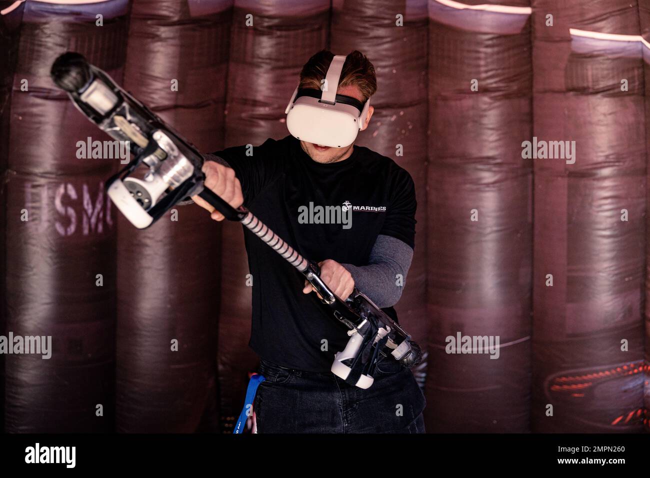 An attendee of Aviation Nation participates in "Battle Position", a ...