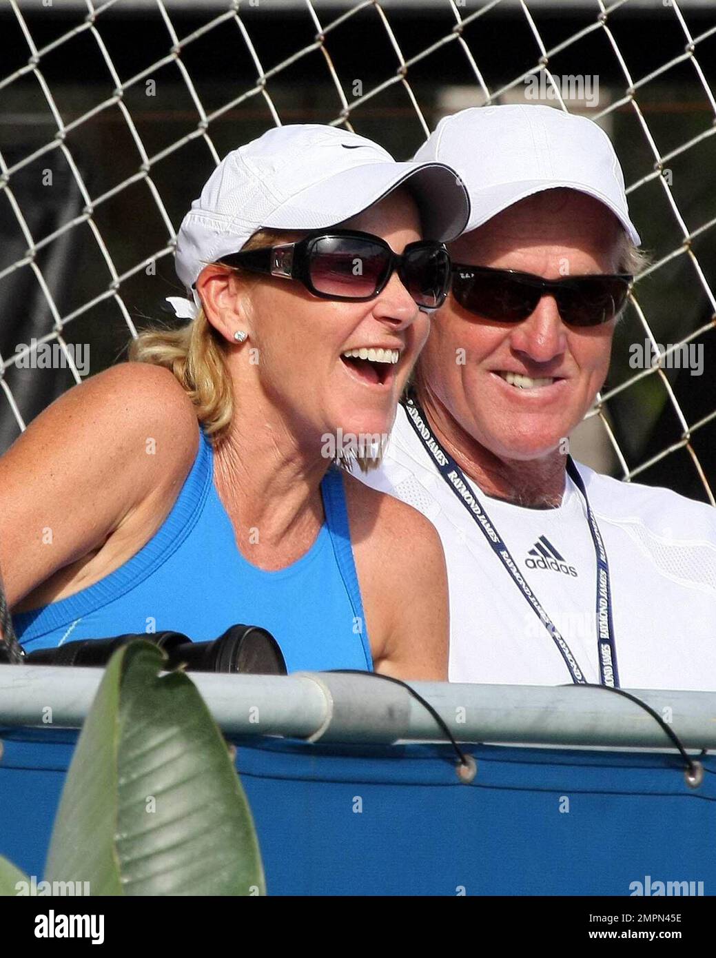 Chris Evert and Greb Norman watch a match at the Chris Evert-Raymond ...
