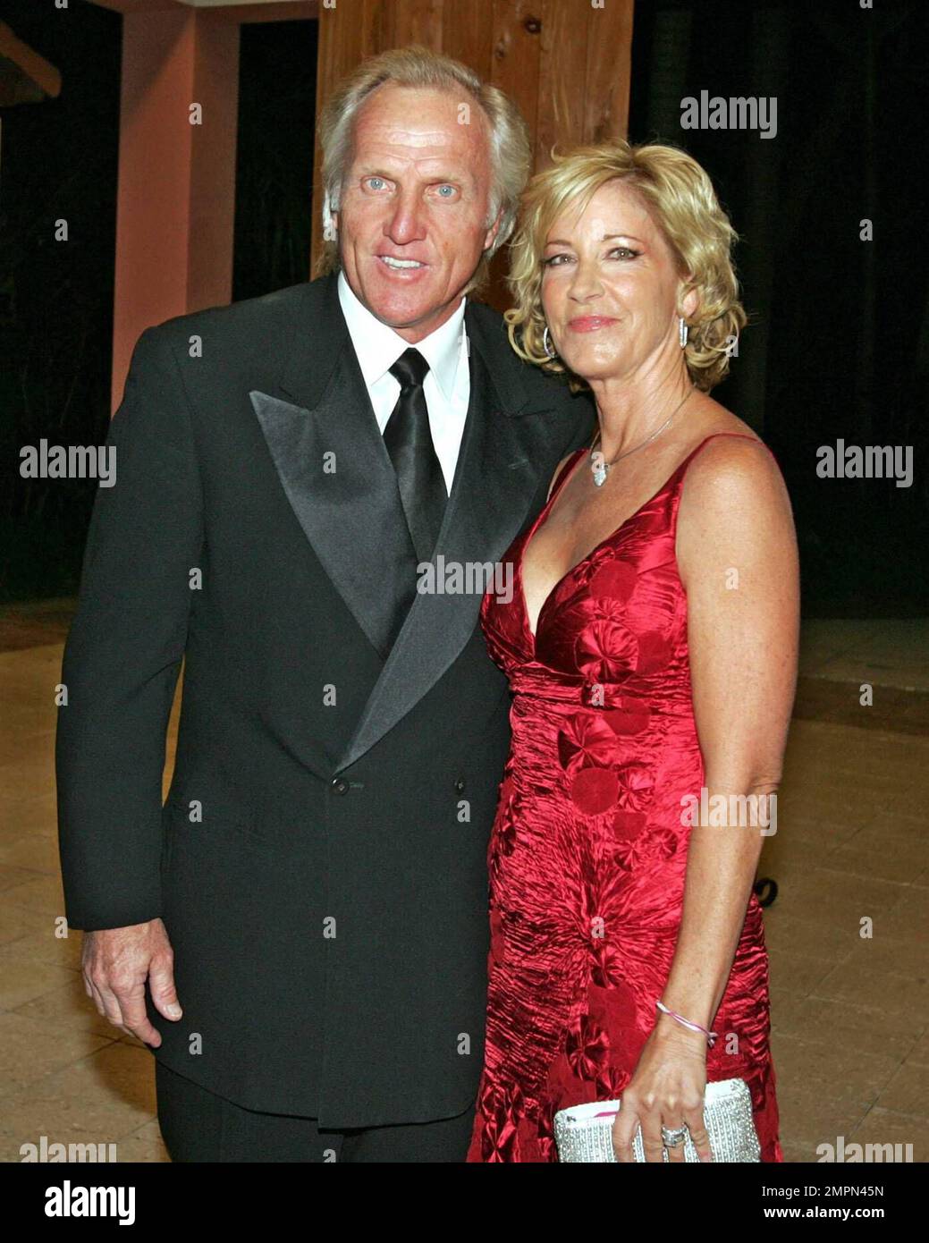 Greg Norman and Chris Evert walk the red carpet at the Chris Evert ...