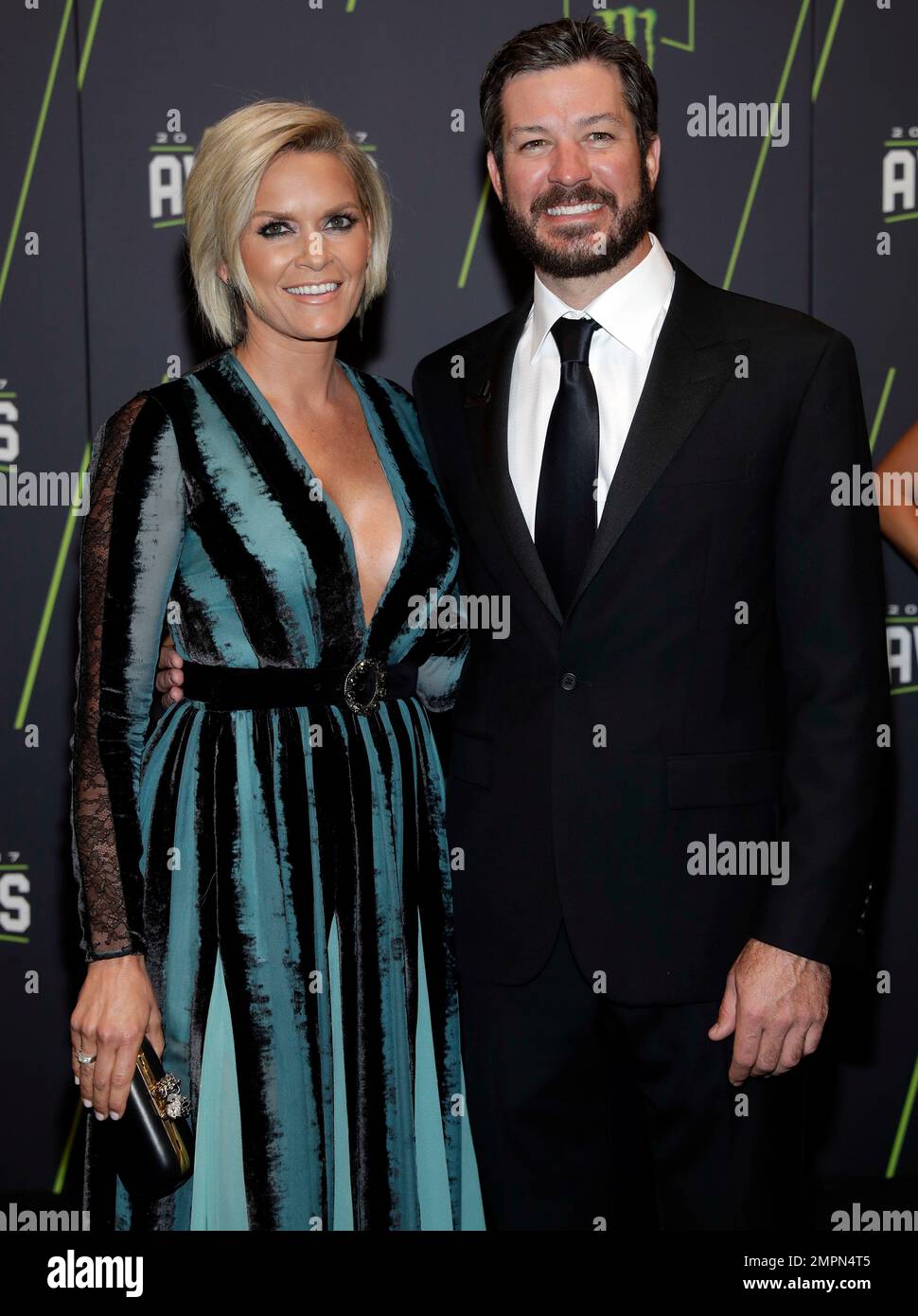 Martin Truex Jr., right, and Sherry Pollex arrive at the NASCAR Cup ...