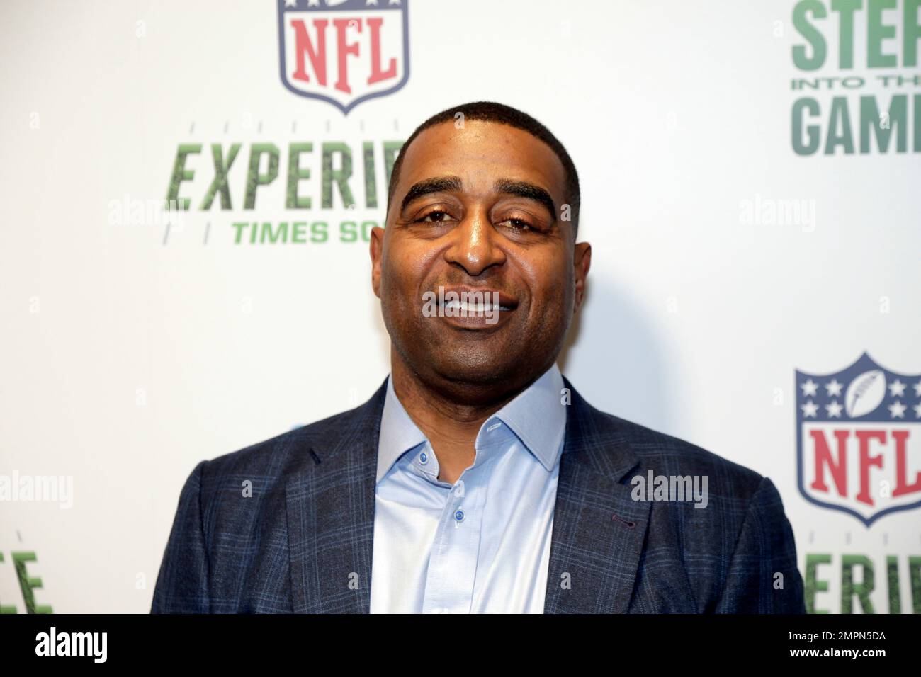 Former wide receiver Anthony Carter poses for a picture at the opening ...