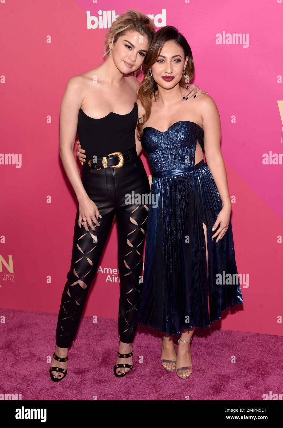 Selena Gomez, left, and Francia Raisa arrive at the Billboard Women in ...