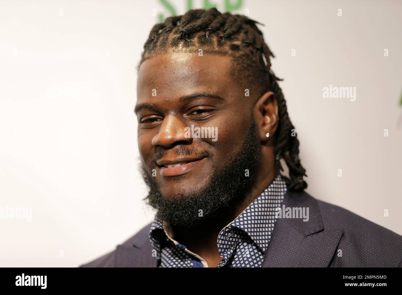 Atlanta Falcons Martin Efedi poses for a picture at the opening of "NFL ...