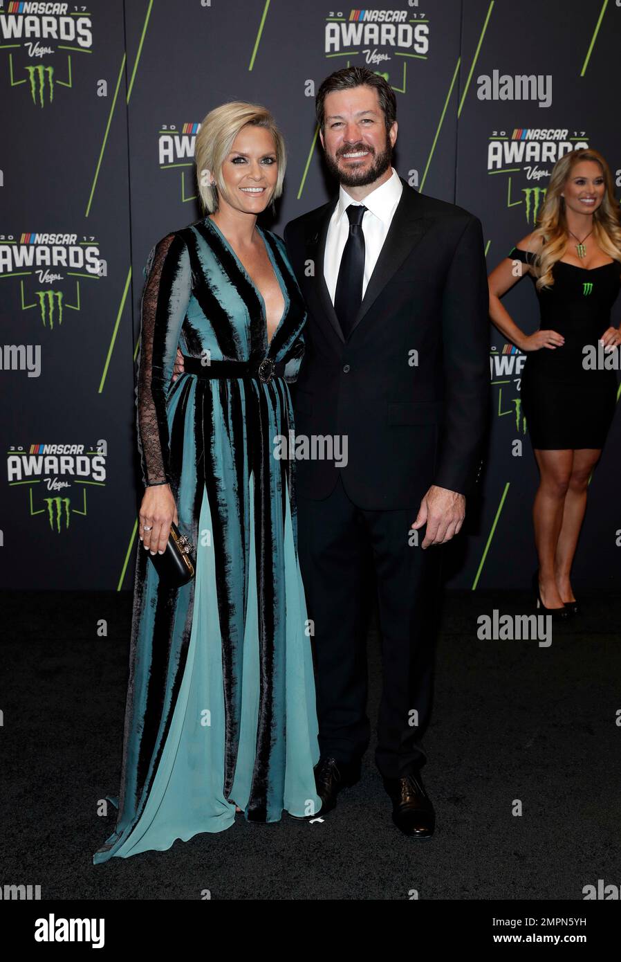 Martin Truex Jr., right, and Sherry Pollex arrive at the NASCAR Cup ...