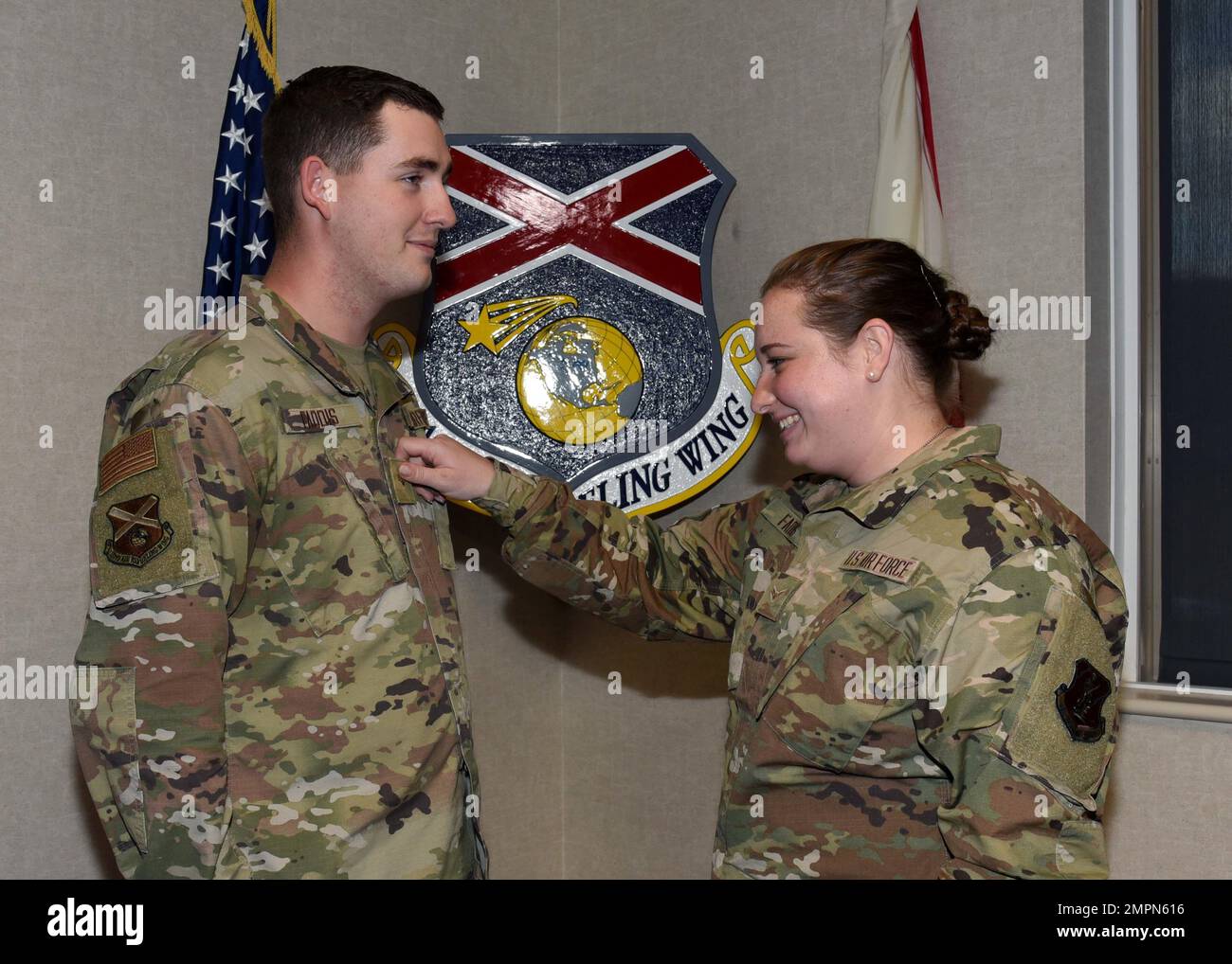 From left, Staff Sgt. Nicholas Faddis, has his senior airman rank ...