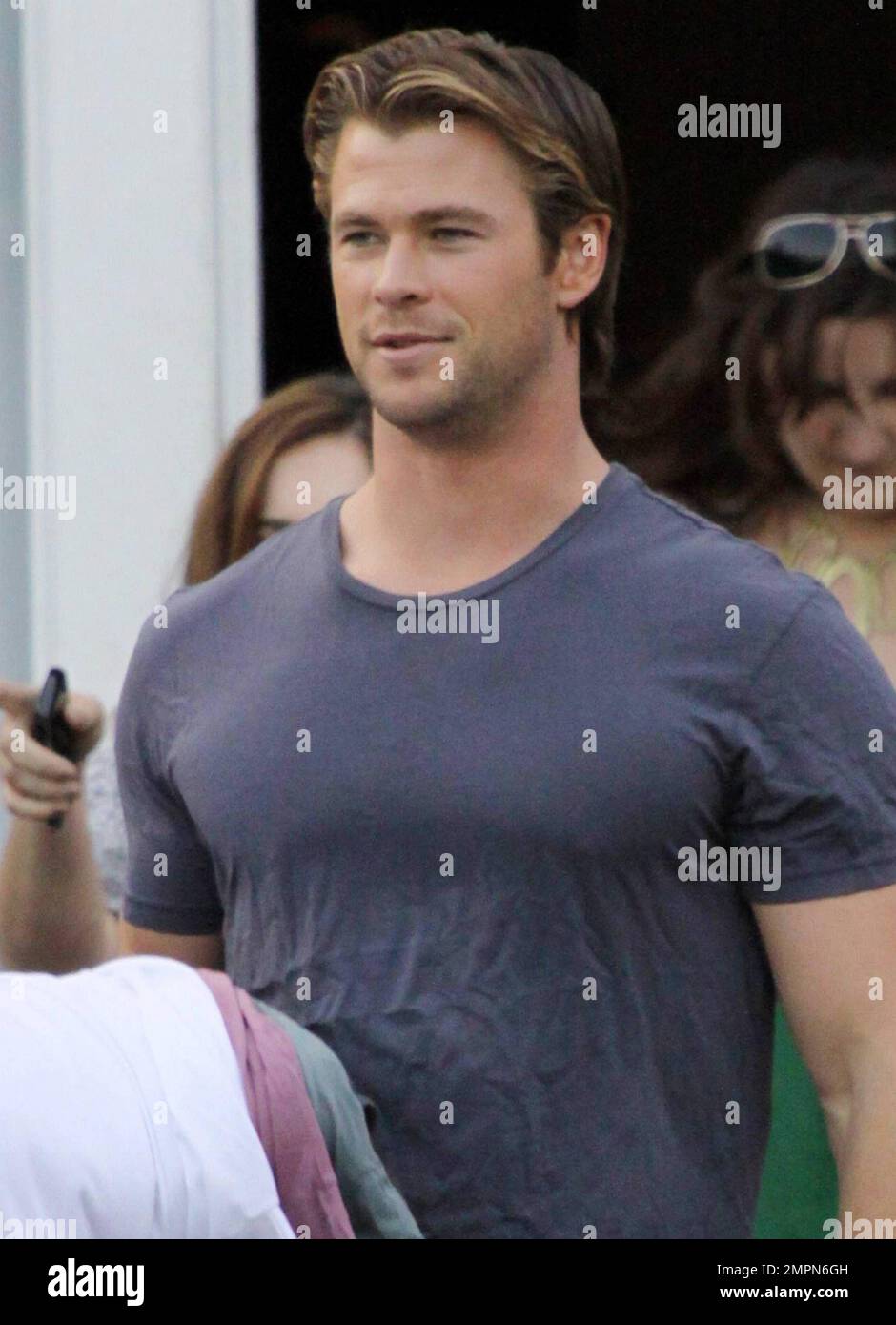 EXCLUSIVE!! Actor Chris Hemsworth carries a variety of shirts as he ...