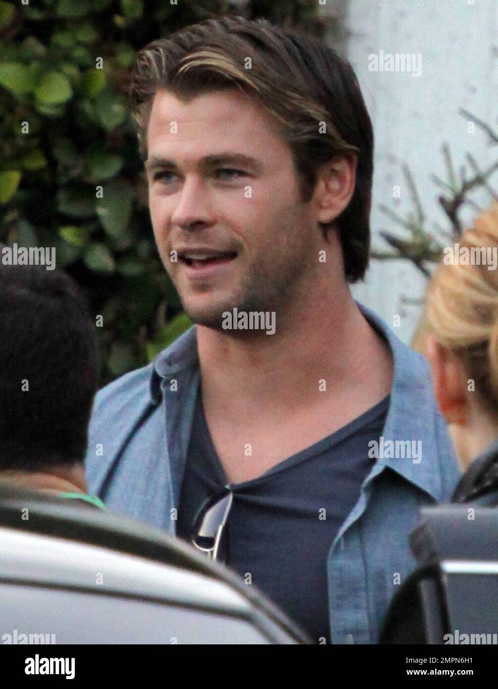 EXCLUSIVE!! Actor Chris Hemsworth carries a variety of shirts as he ...