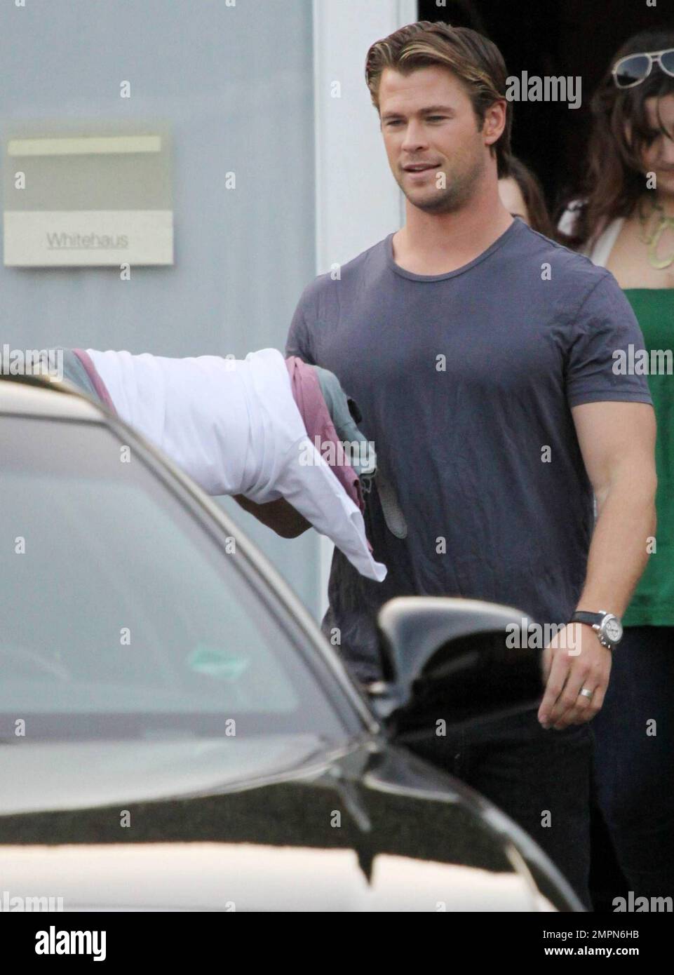 EXCLUSIVE!! Actor Chris Hemsworth carries a variety of shirts as he ...