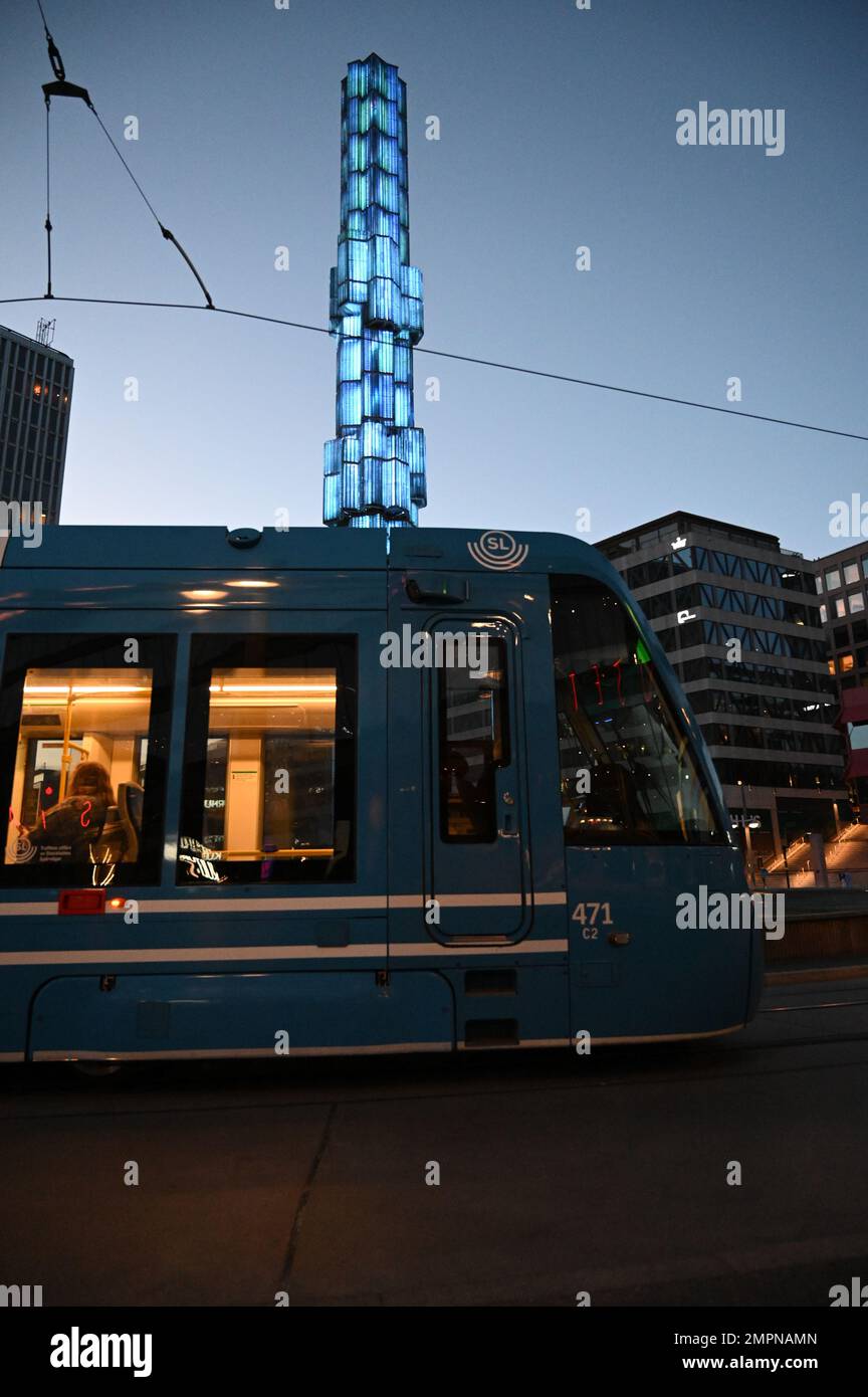 A monumental blue building on the street at a metro station in ...