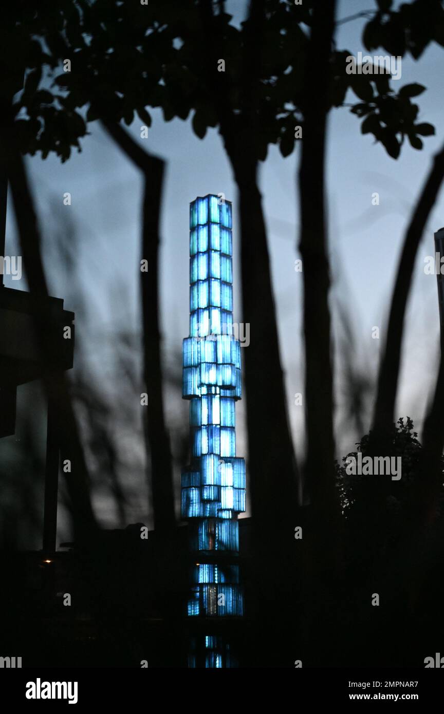 A monumental blue building on the street at a metro station in ...