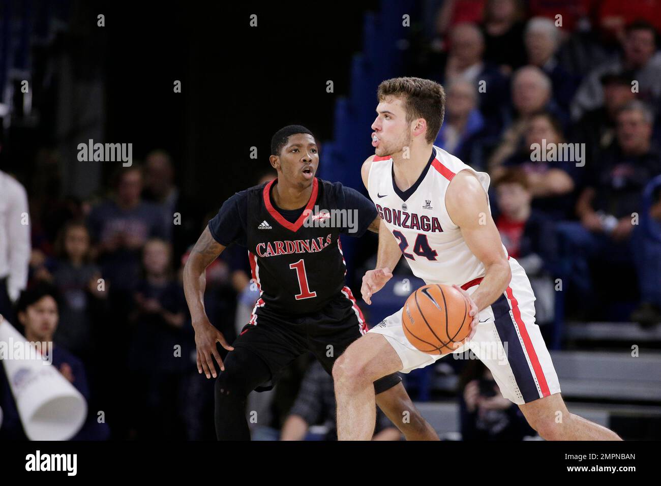 Gonzaga forward Corey Kispert (24) dribbles the ball while defended by ...