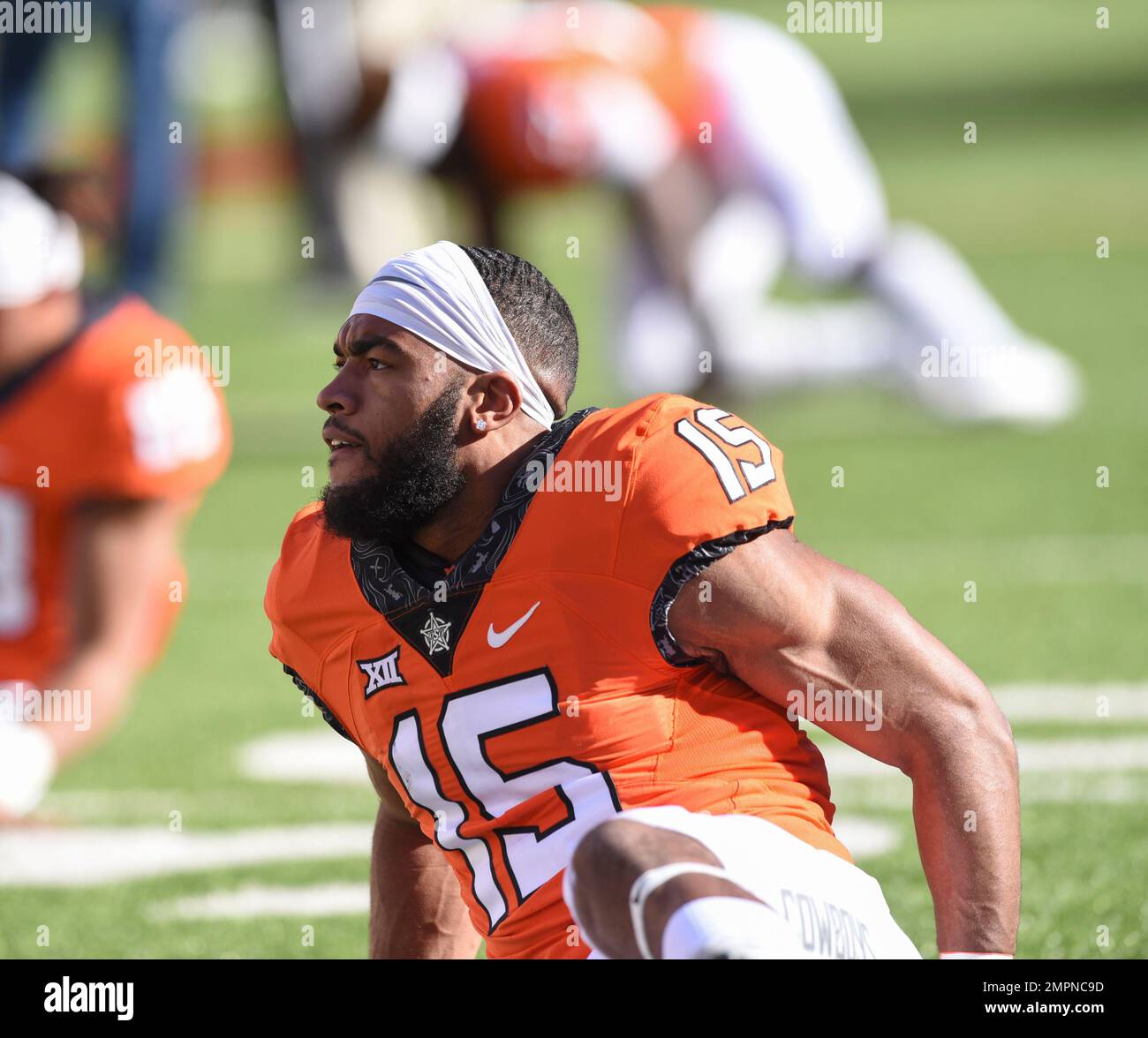 Oklahoma St wide receiver Chris Lacy stretches prior to a NCAA college ...