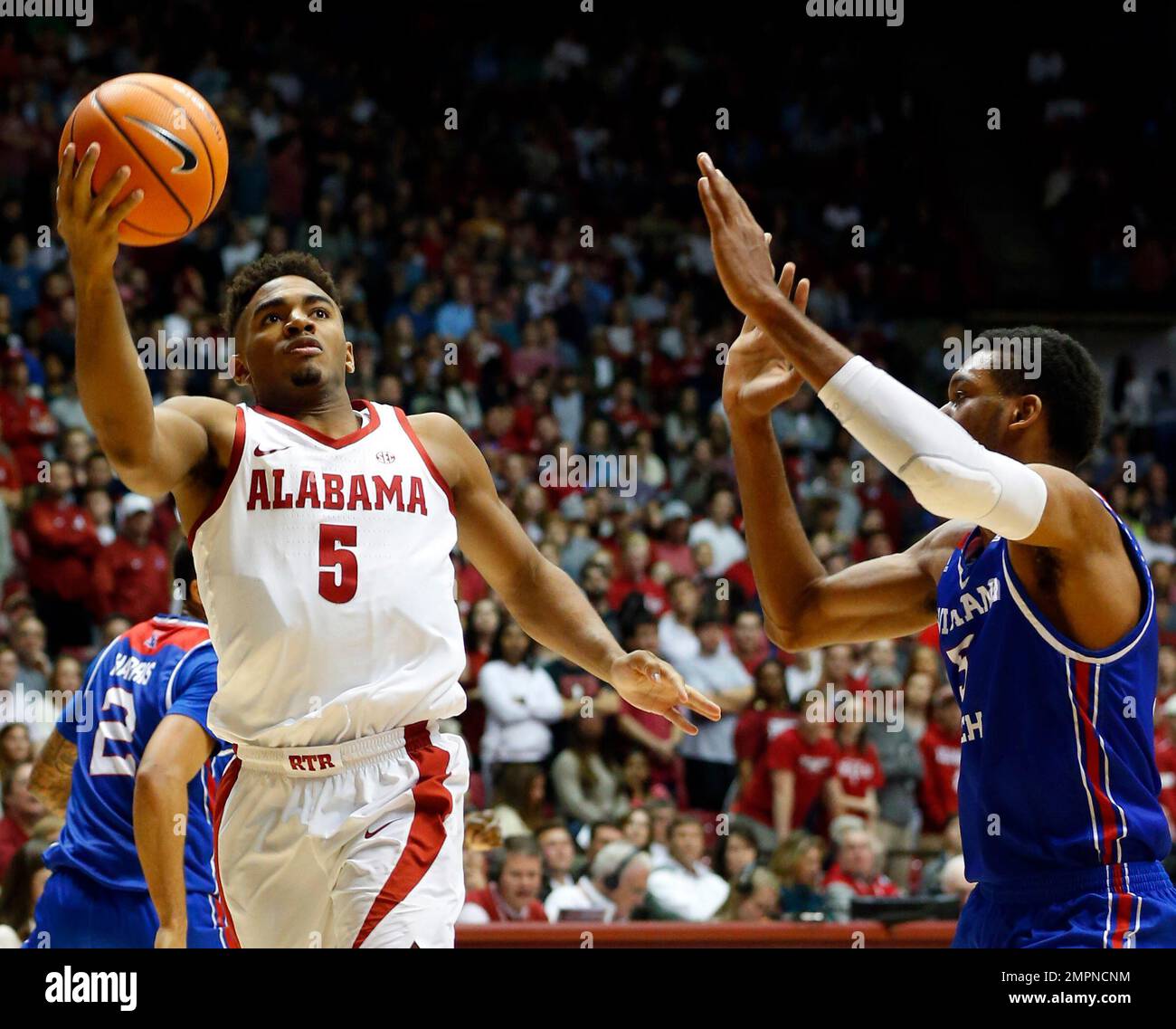 Alabama guard Avery Johnson Jr. (5) puts up a shot around Louisiana ...
