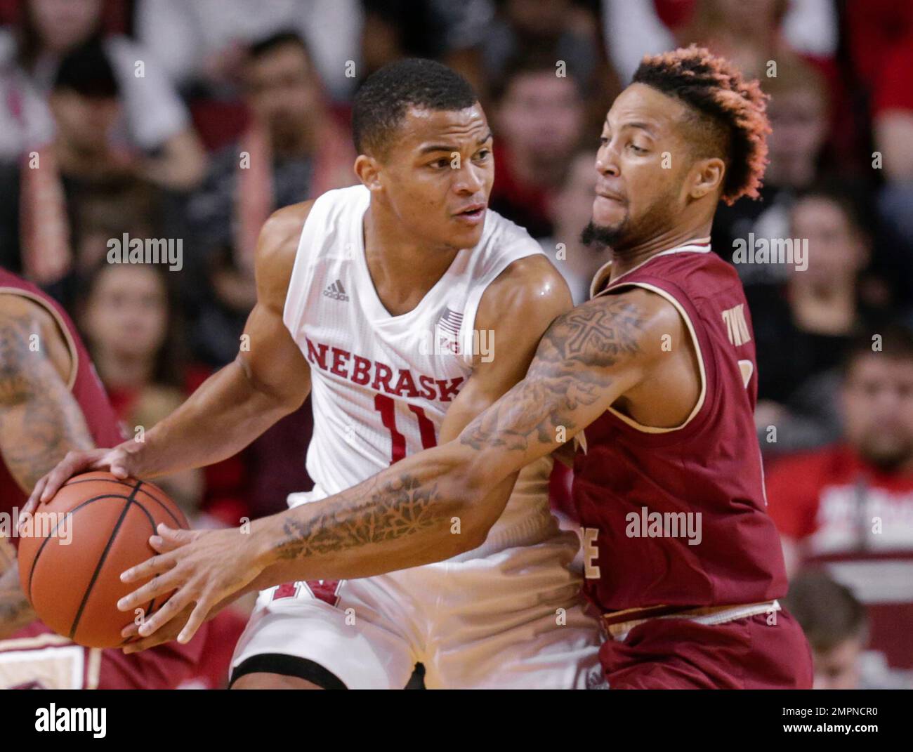 Nebraska's Evan Taylor (11) is defended by Boston College's Ky Bowman ...