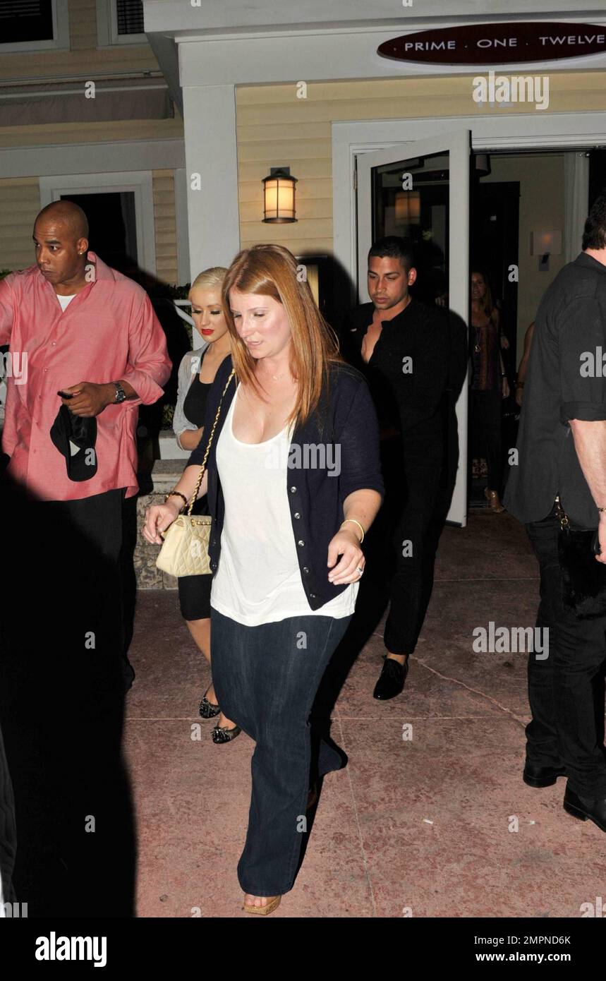 Christina Aguilera, wearing a slinky black dress, leaves Prime 112 with ...
