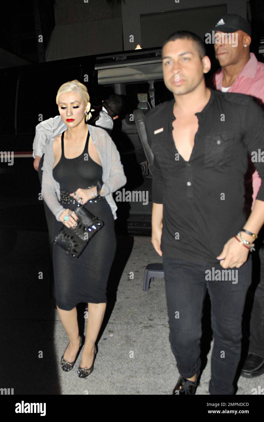 Christina Aguilera, wearing a slinky black dress, arrives at Prime 112 ...