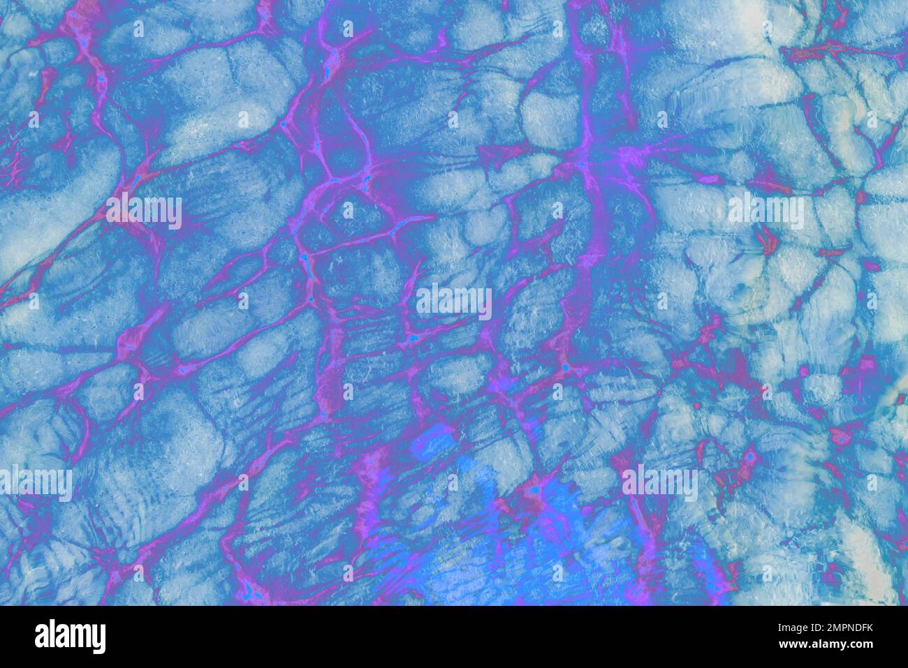 Abstract photo of a glowing water surface with blue light reflecting ...