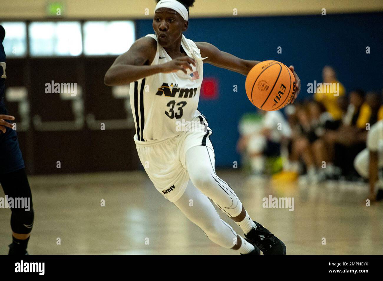 Army Sgt. Precious Williams takes the ball up court during the 2022 ...