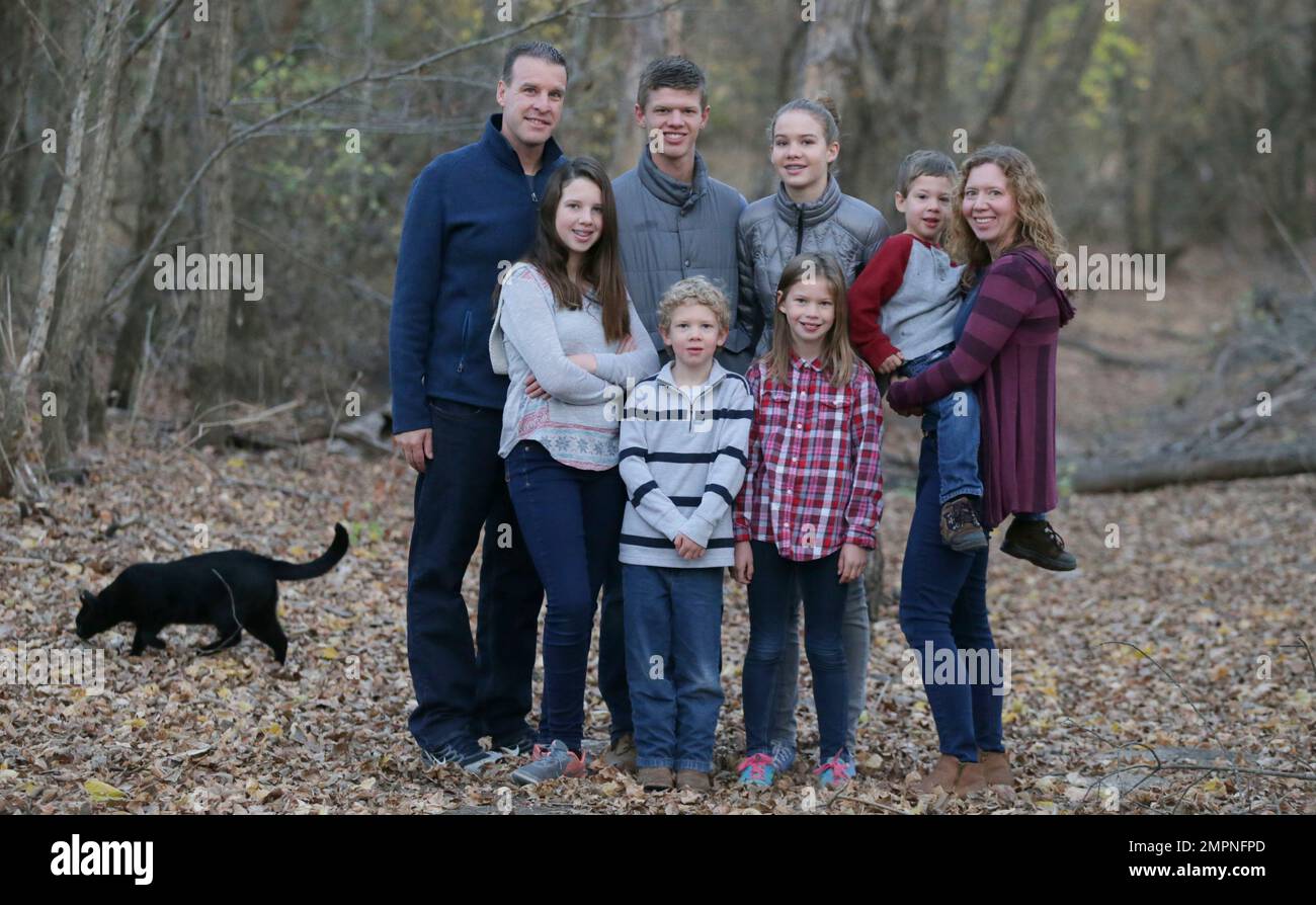 Jason Blake, back left, and his wife Shannon Black, back right, pose ...