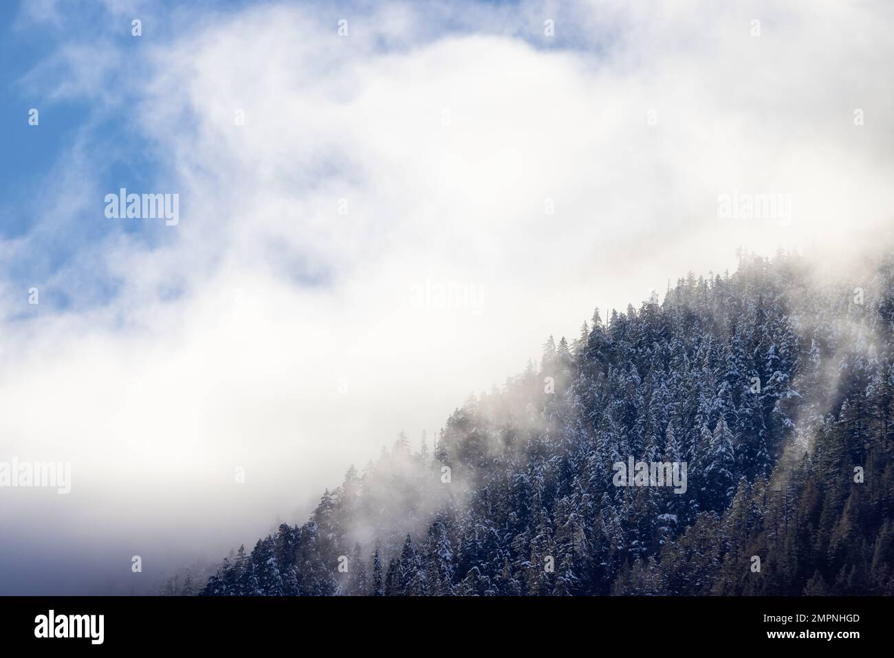 Snow and Cloud covered Canadian Nature Landscape Background Stock Photo ...