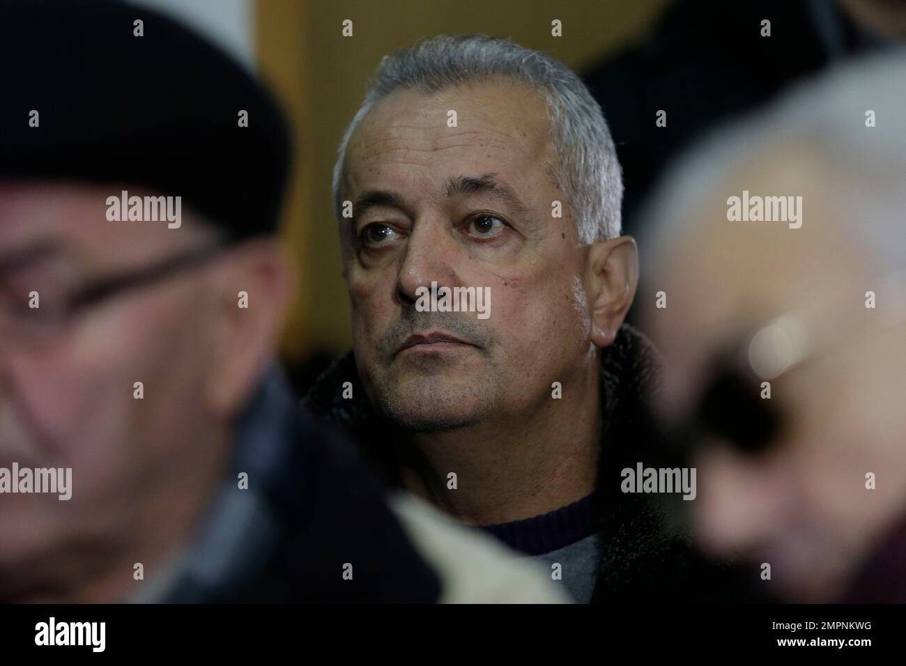 Bosnian people watch the live TV broadcast from the International ...