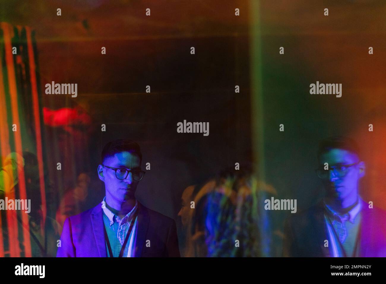 Reflection of business colleagues in seminar during illuminated ...