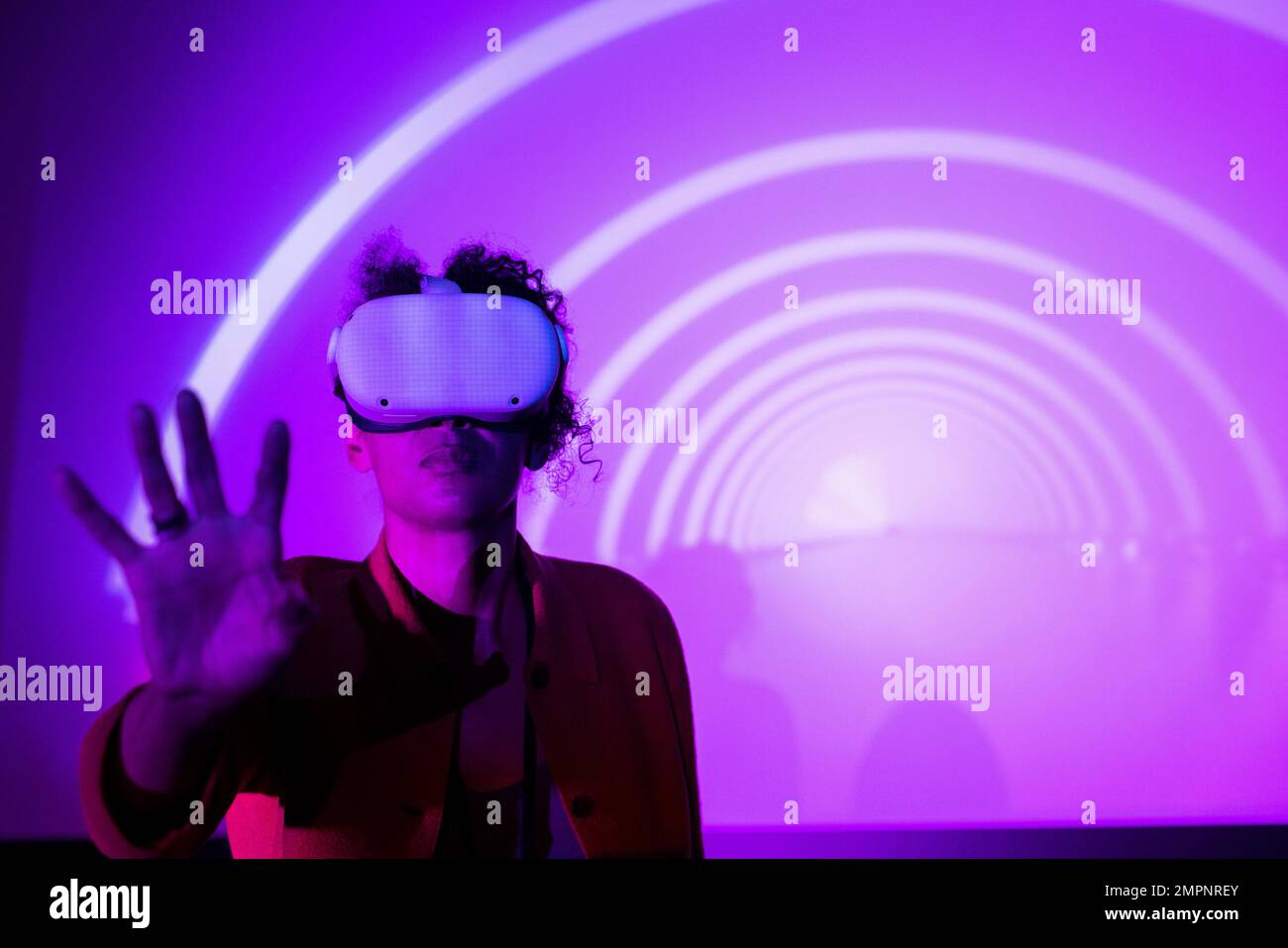 Female entrepreneur wearing futuristic glasses against projection ...