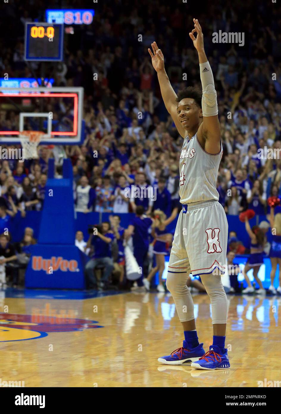Kansas guard Devonte' Graham (4) celebrates a three-point basket at the ...