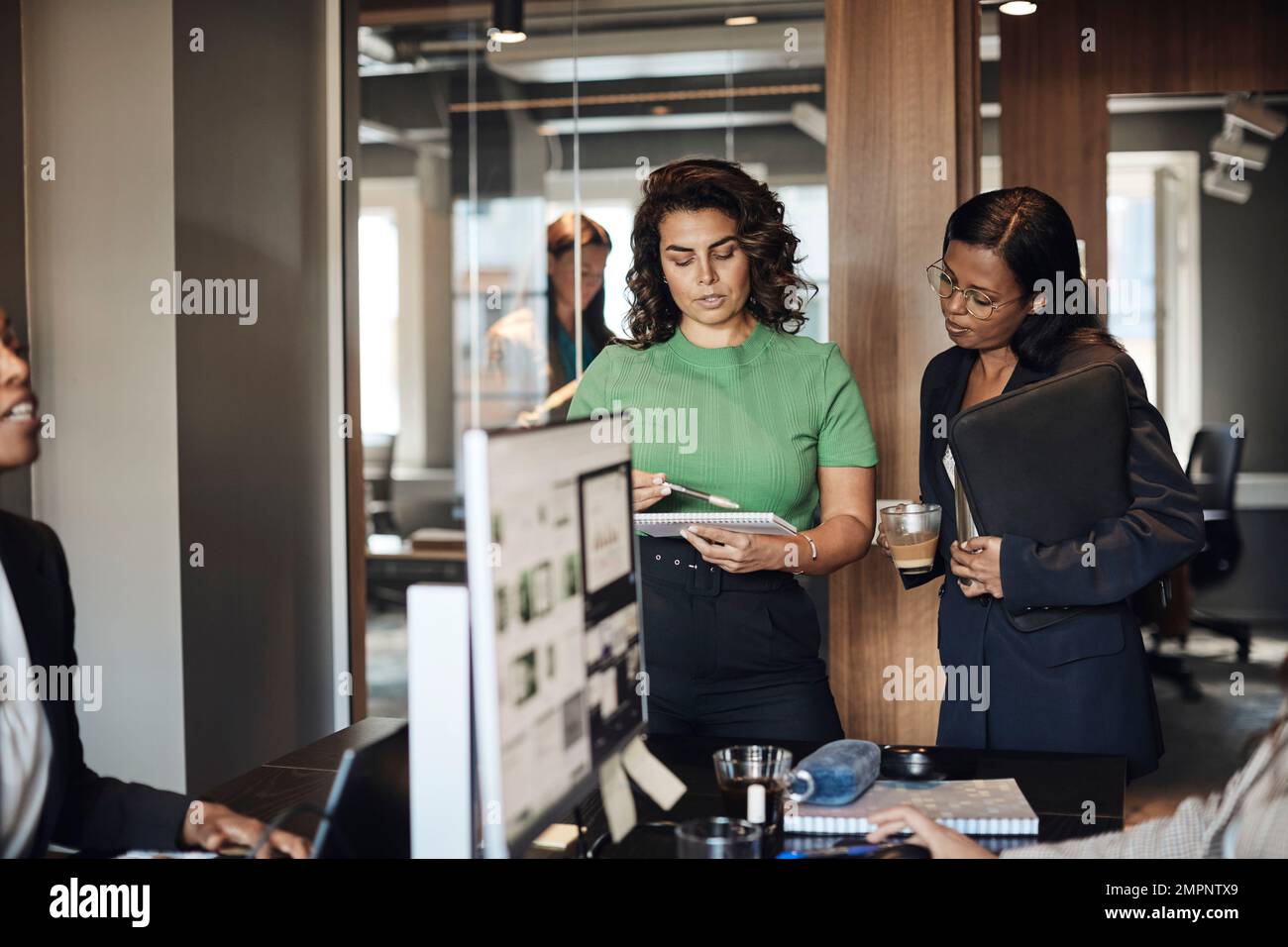 Female business colleagues planning strategy at office Stock Photo - Alamy