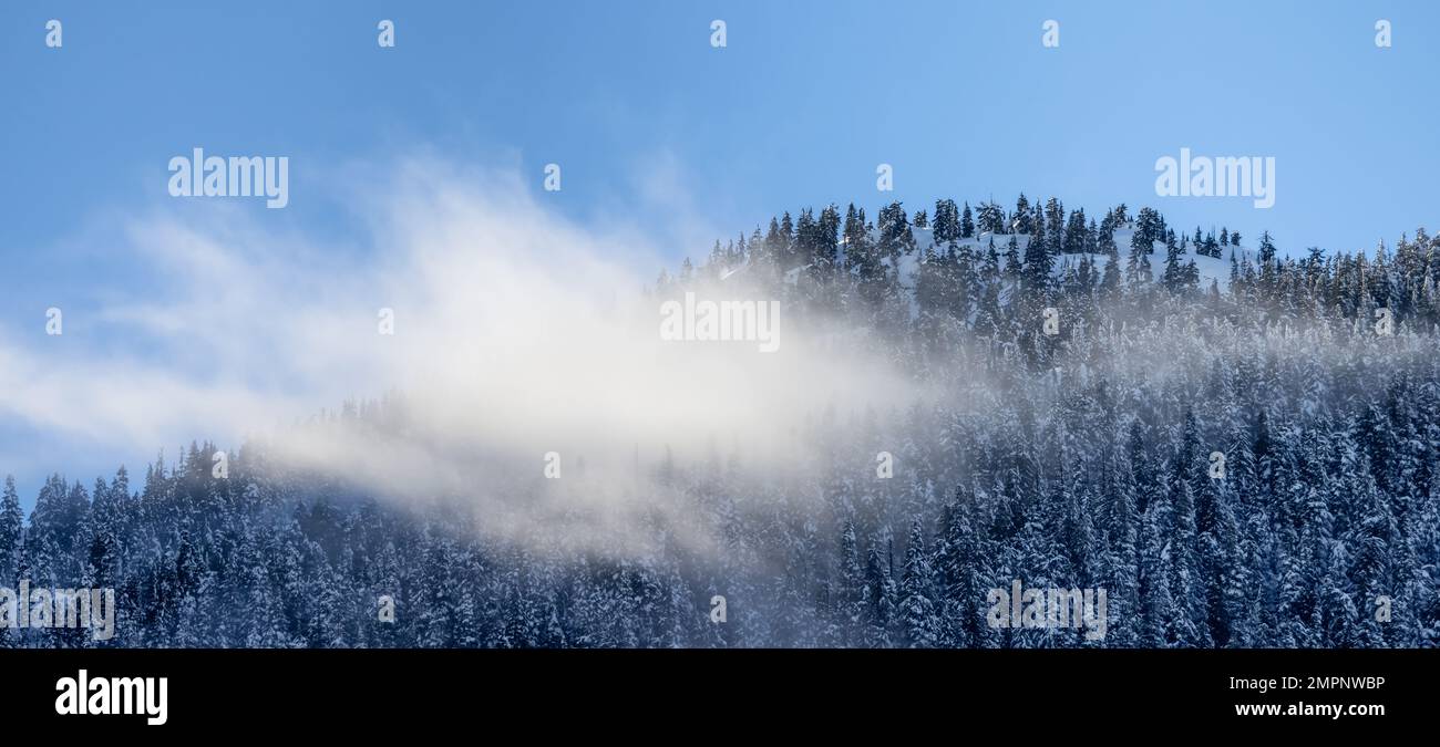 Snow and Cloud covered Canadian Nature Landscape Background Stock Photo ...