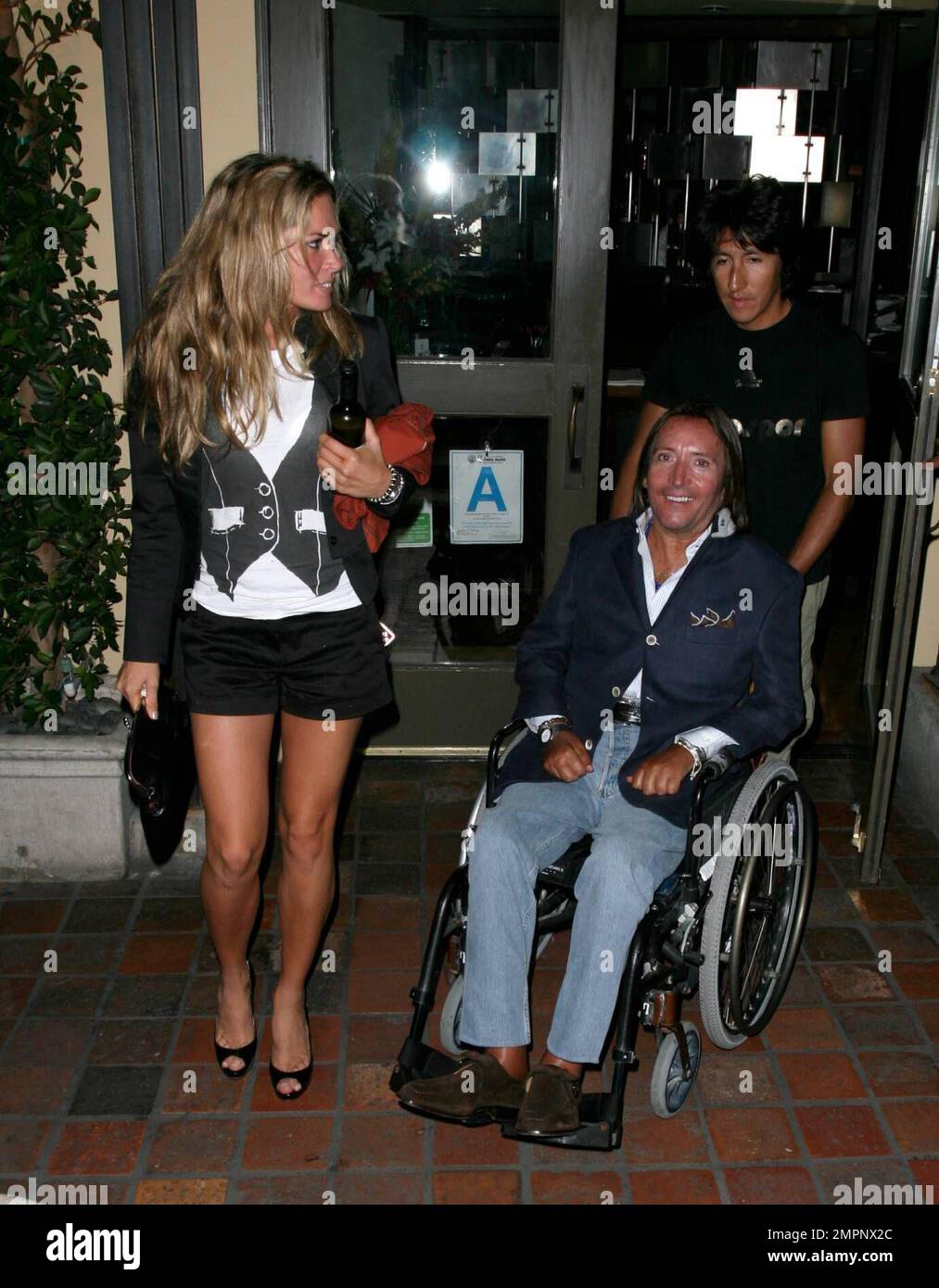 Exclusive!! Cindy Taylor leaves AGO with a friend in a wheelchair. Los ...