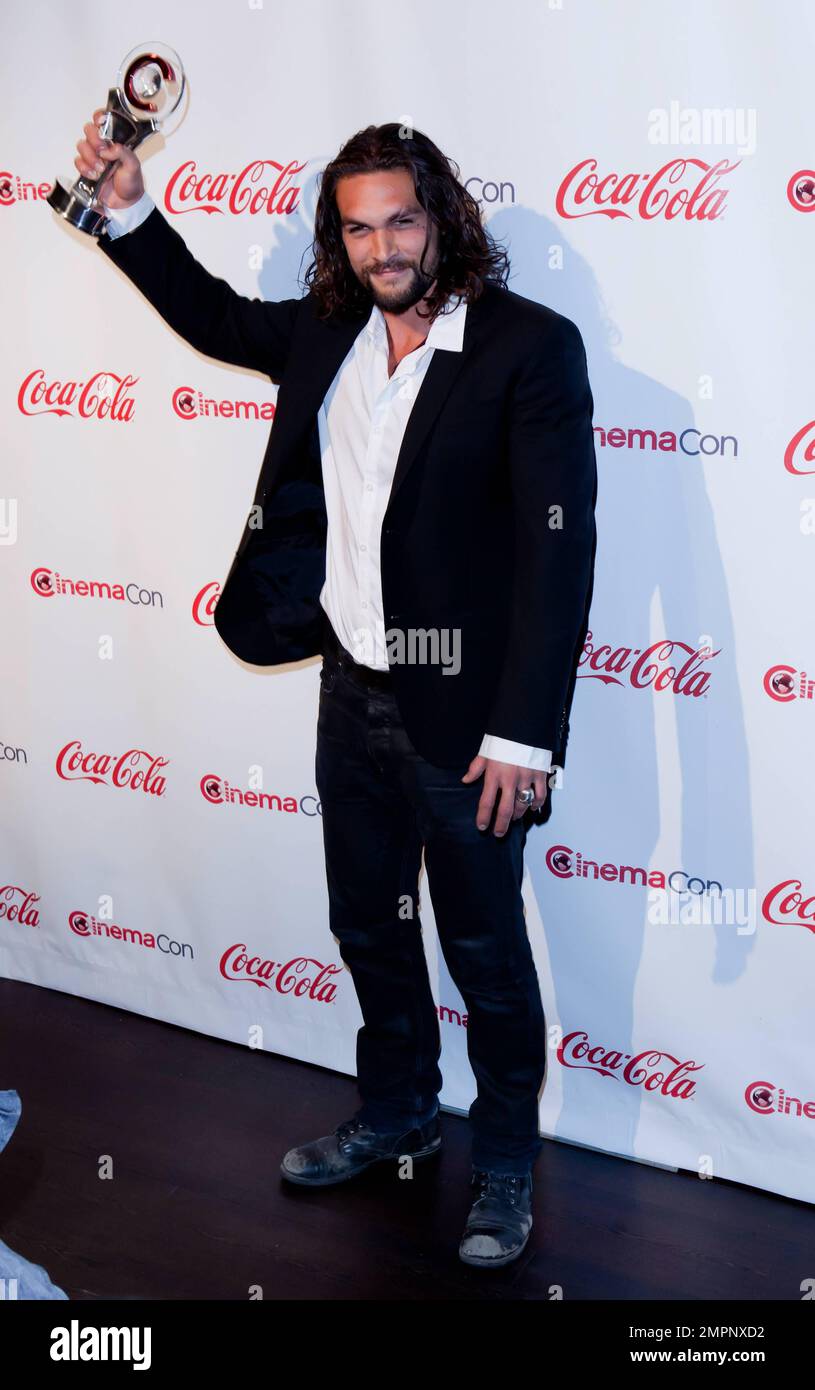 Jason Momoa poses for photographers at the 2011 CinemaCon Big Screen ...