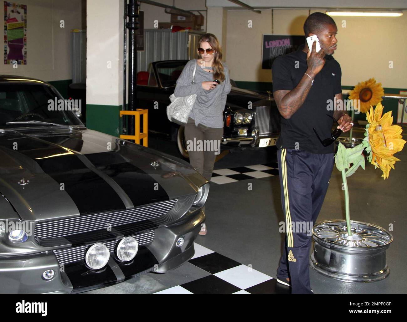 EXCLUSIVE!! French soccer player Djibril Cisse and wife Jude arrive at ...