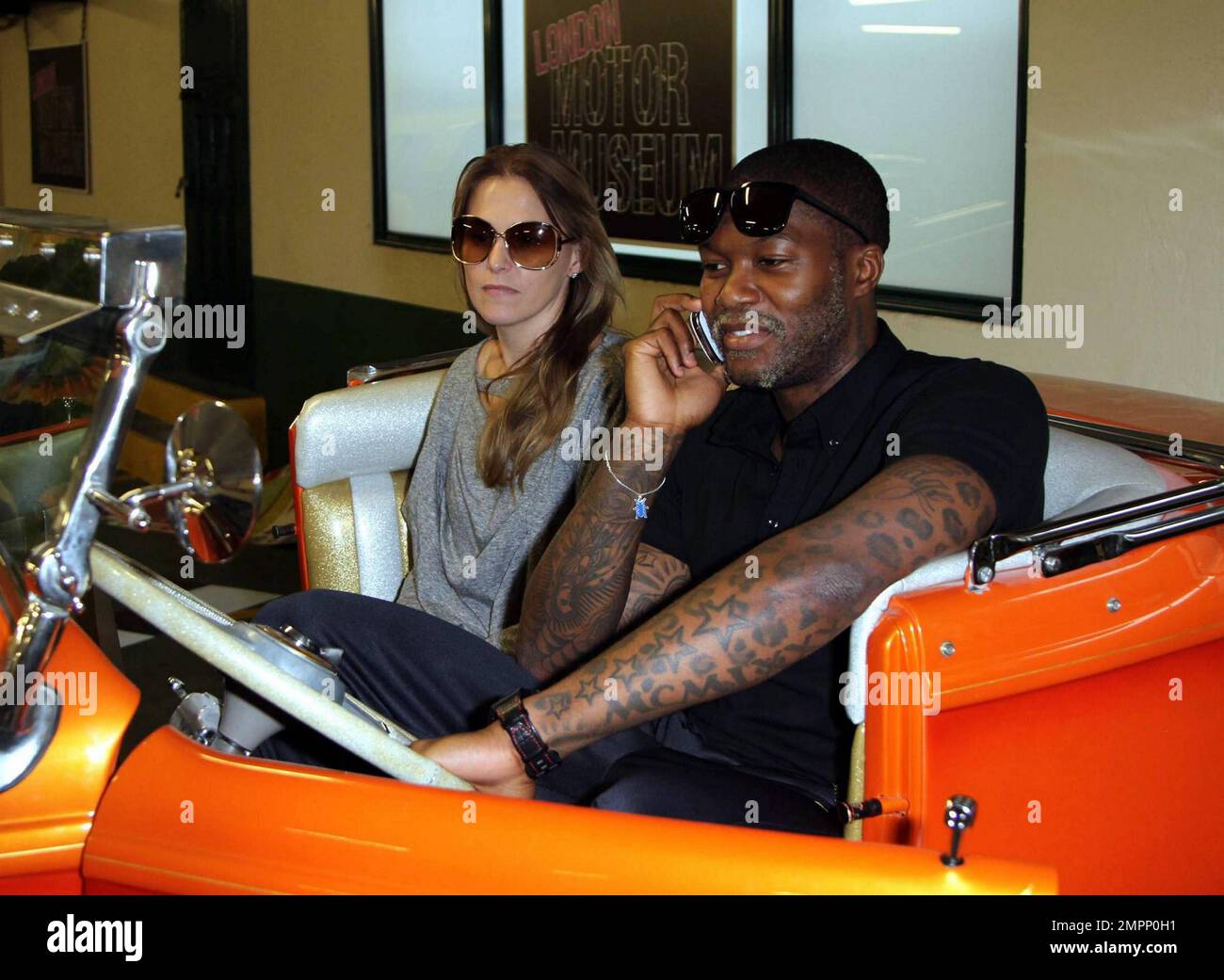 EXCLUSIVE!! French soccer player Djibril Cisse and wife Jude arrive at ...