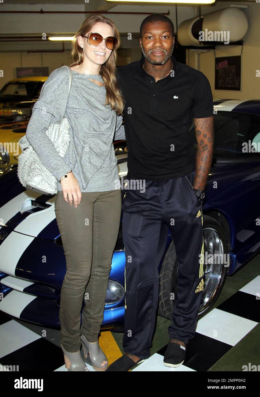 EXCLUSIVE!! French soccer player Djibril Cisse and wife Jude arrive at ...